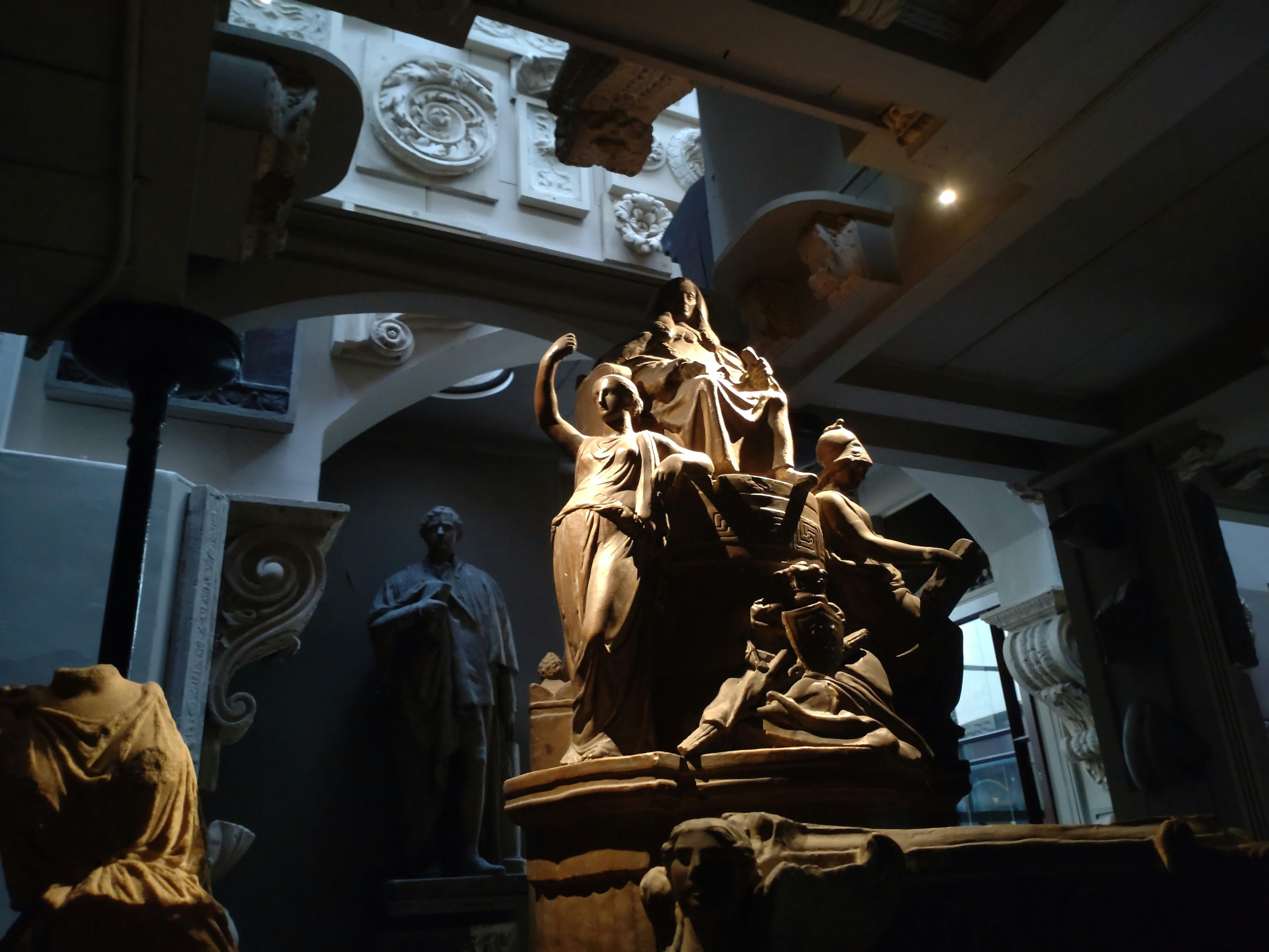 A statue in a museum with a skylight in the background photo – Free ...
