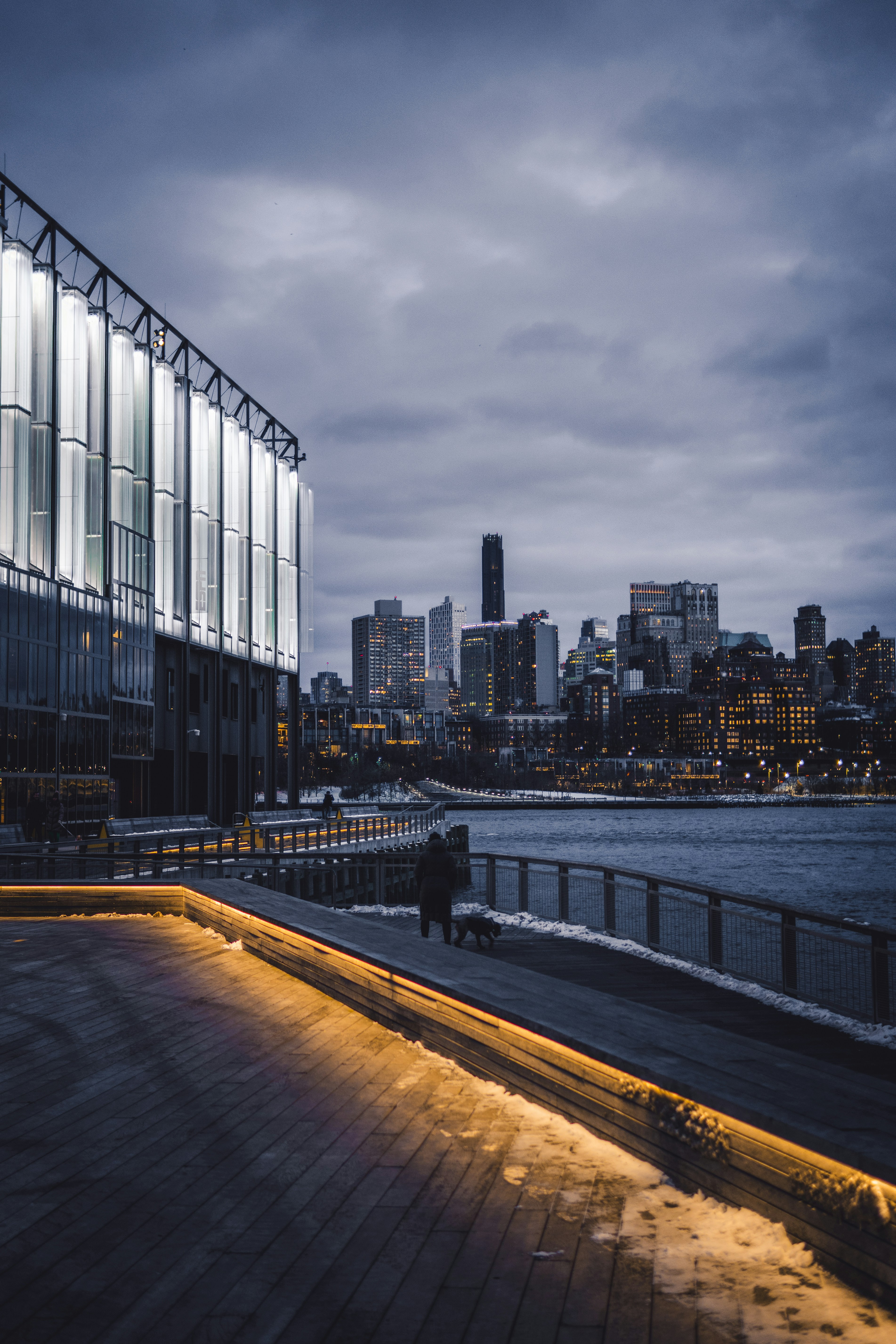 Luminous Waterfront Corridor by the Glass Facade