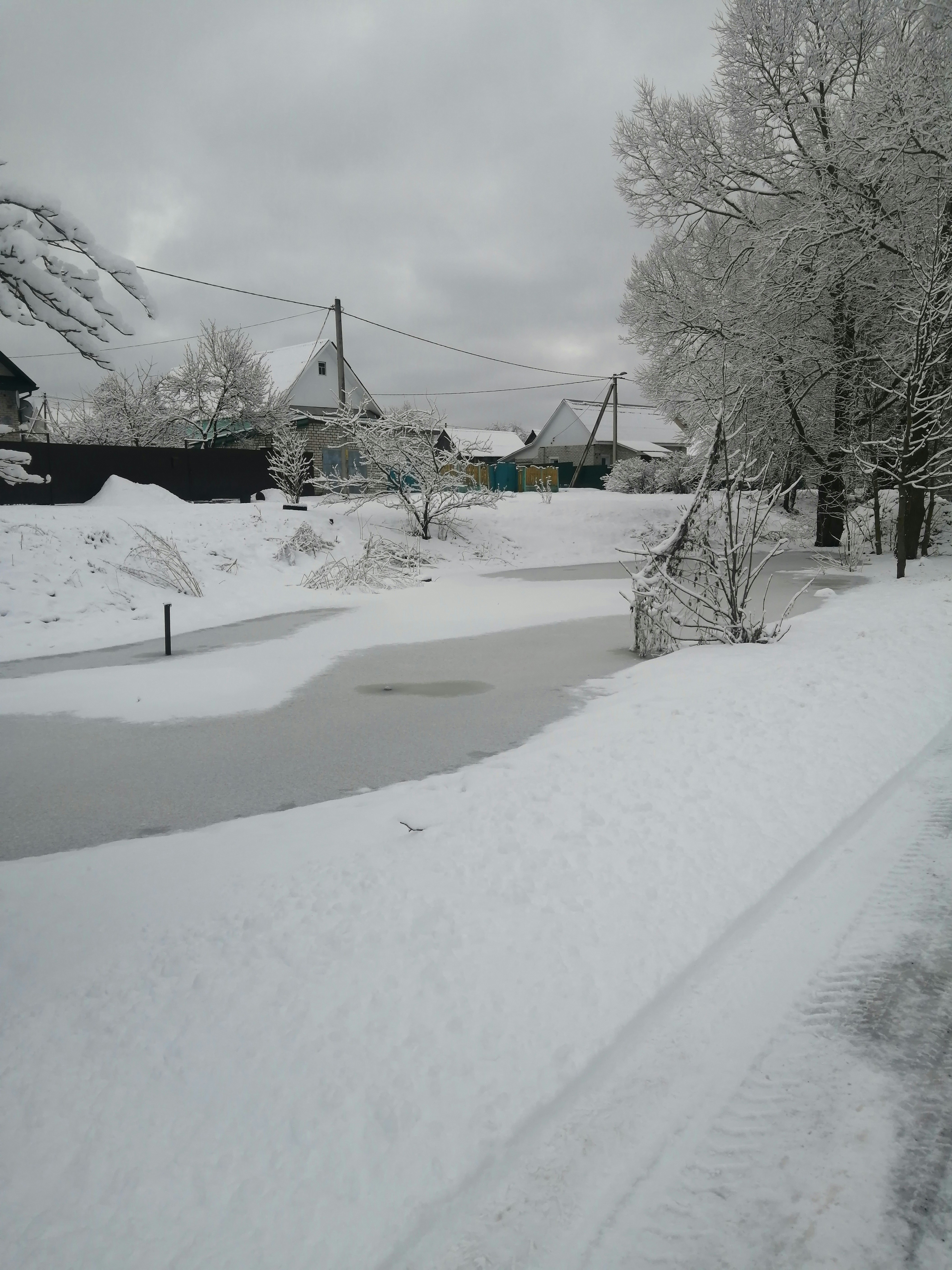 Snowbound Village Beneath a Leaden Winter Sky