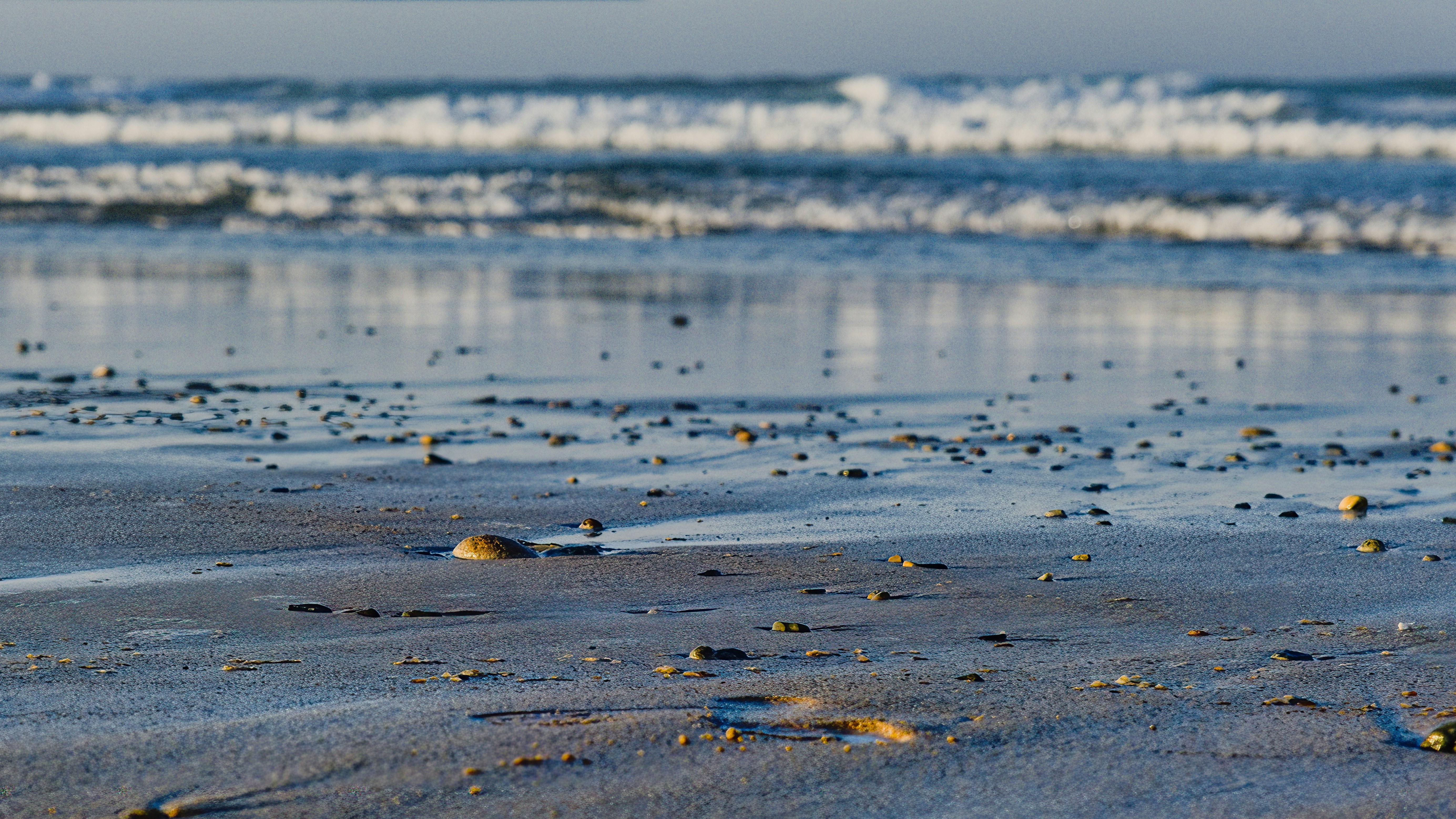 A close up of sand and water on a beach photo – Free Praia de ponzos ...