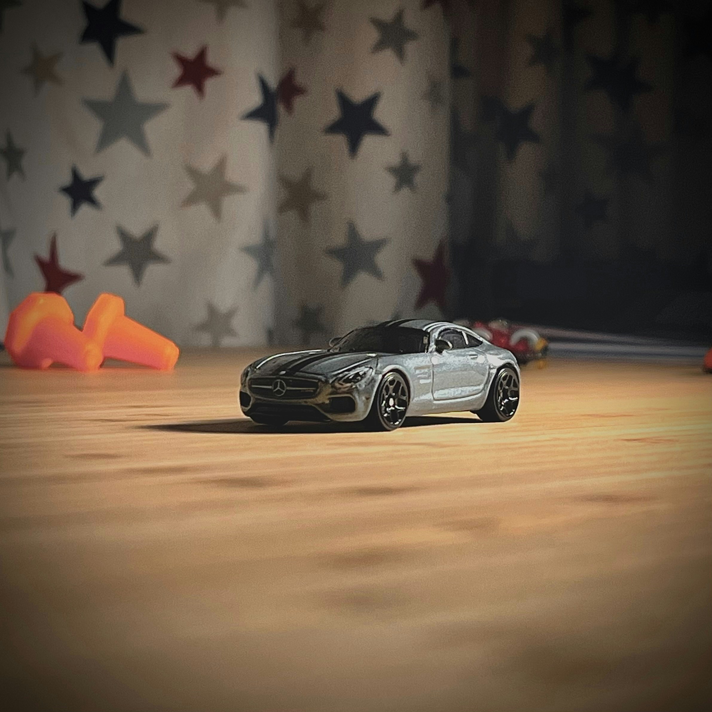 Tiny Merc on a Wooden Stage Under a Starry Backdrop