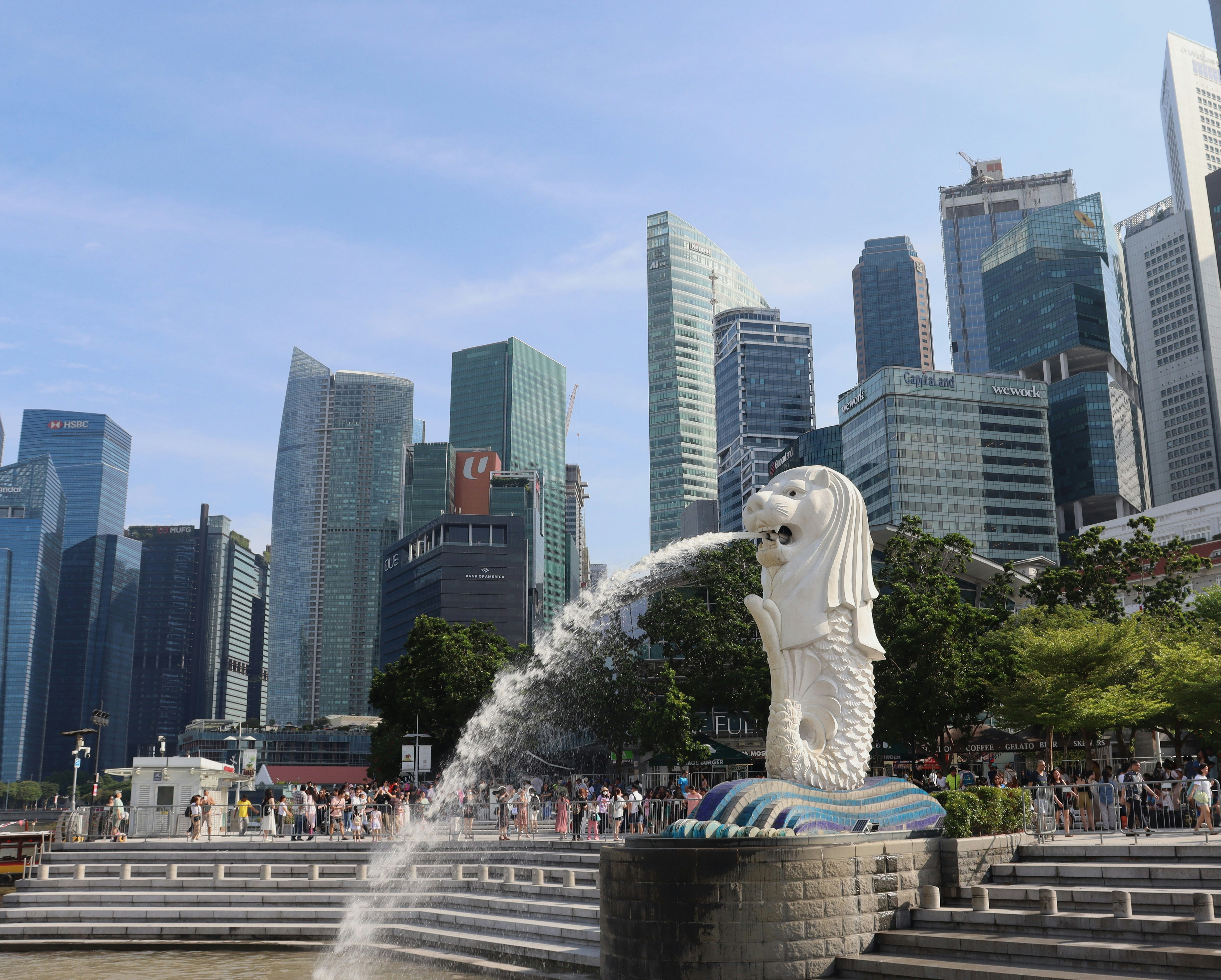 A statue of a woman spewing water into the air photo – Free Merlion ...