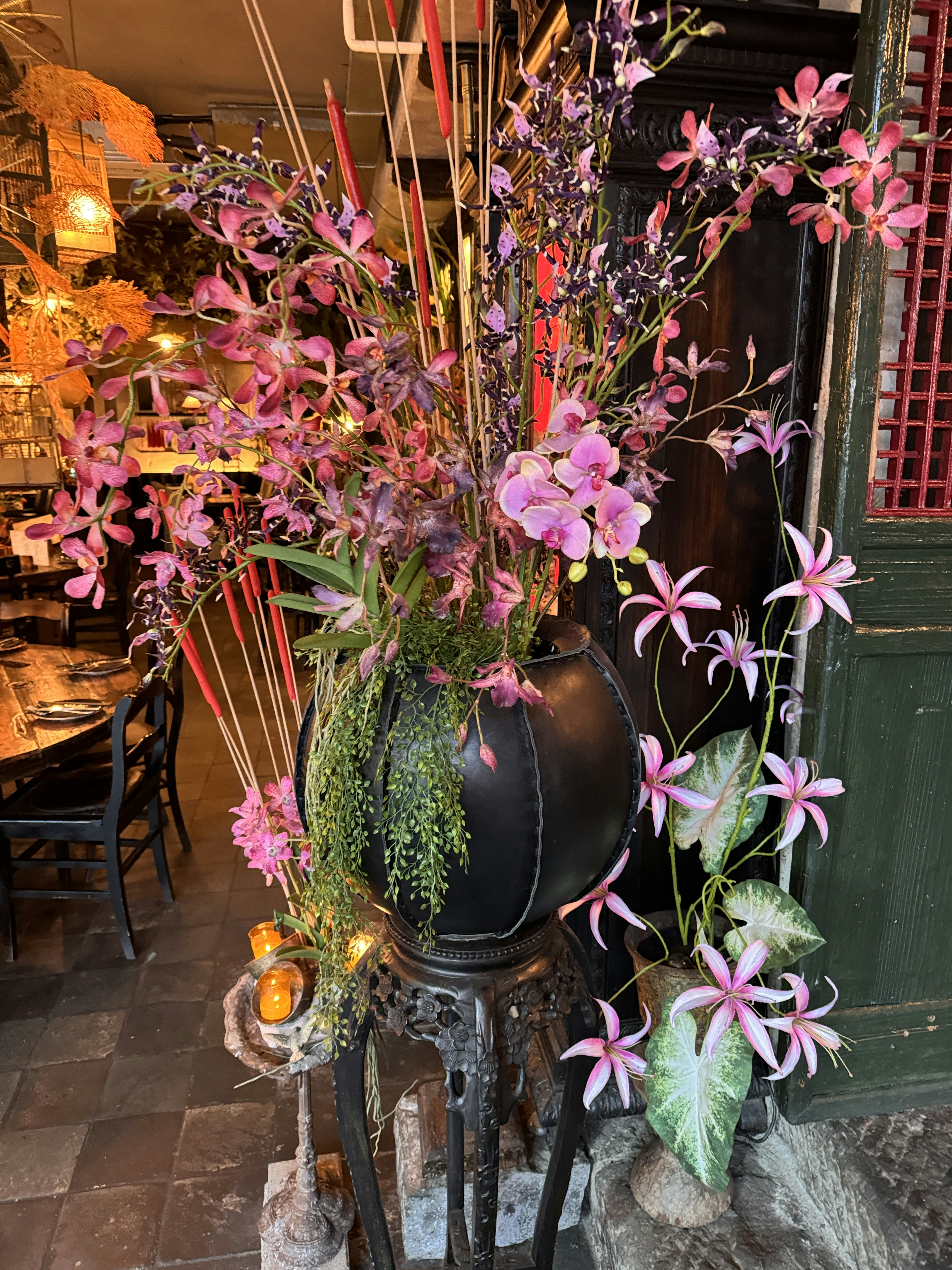 a vase filled with flowers sitting on top of a table