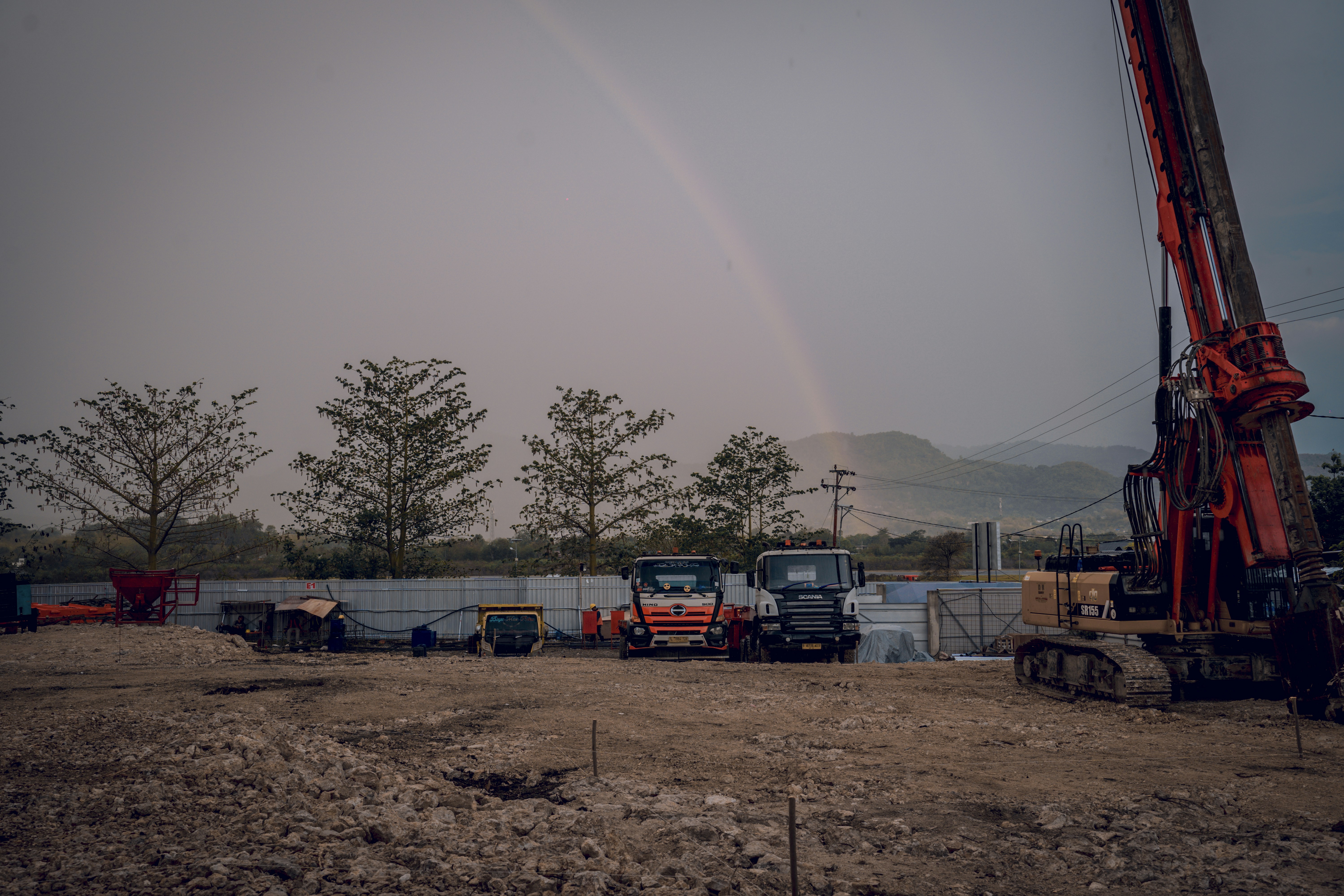 Rainbow Above the Rough Ground: Dawn at the Construction Yard