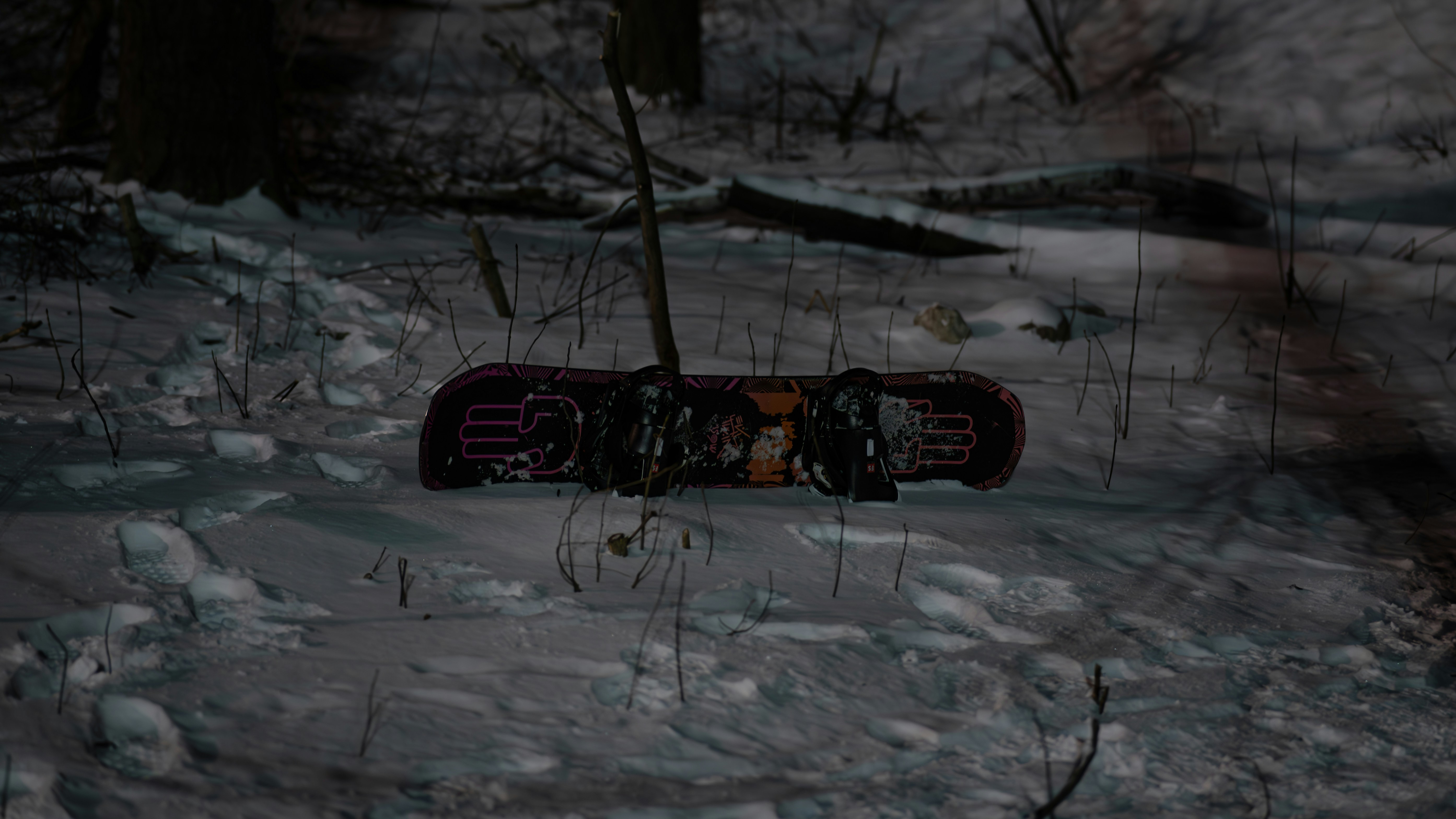 A snowboard laying on the ground in the snow photo – Free Kyiv Image on ...
