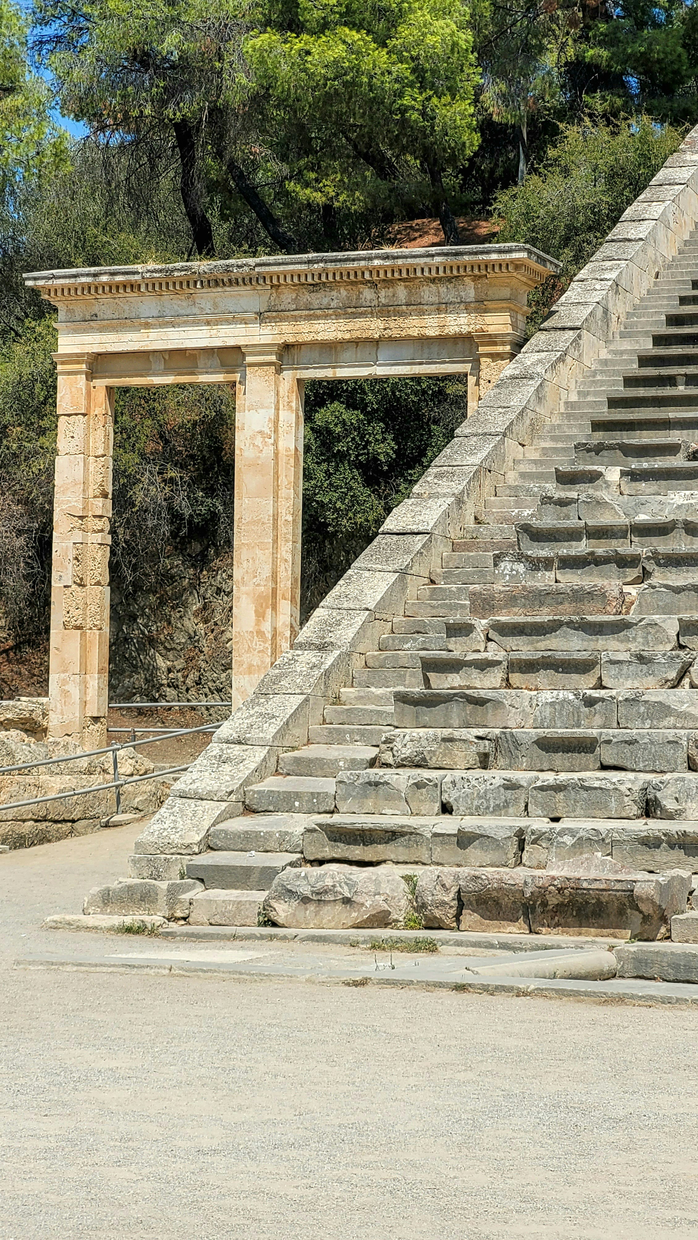 Gate of Light: A Weathered Stone Arch Framing a Rocky Staircase