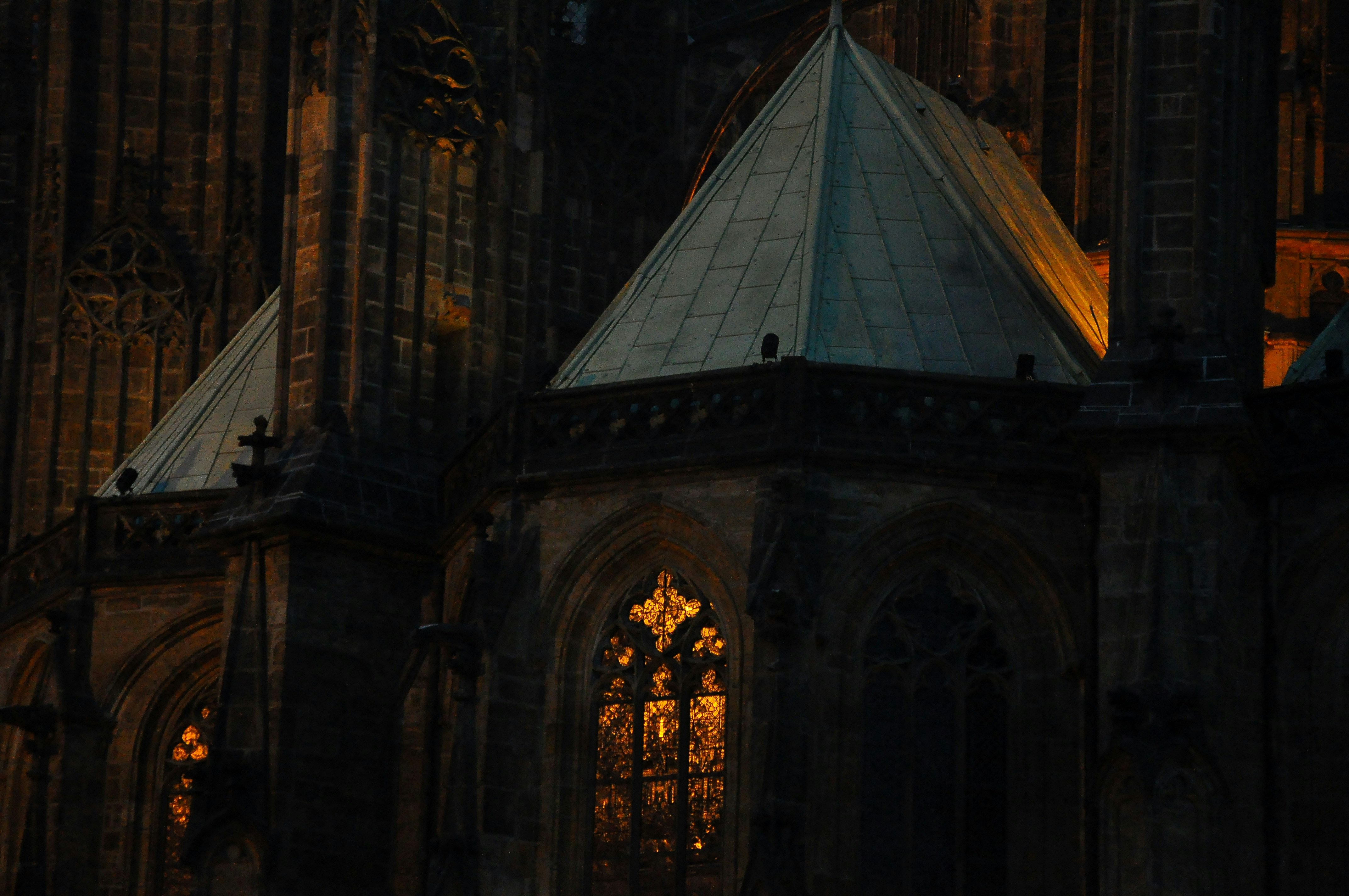 Amber Window Glow Through a Gothic Night Facade