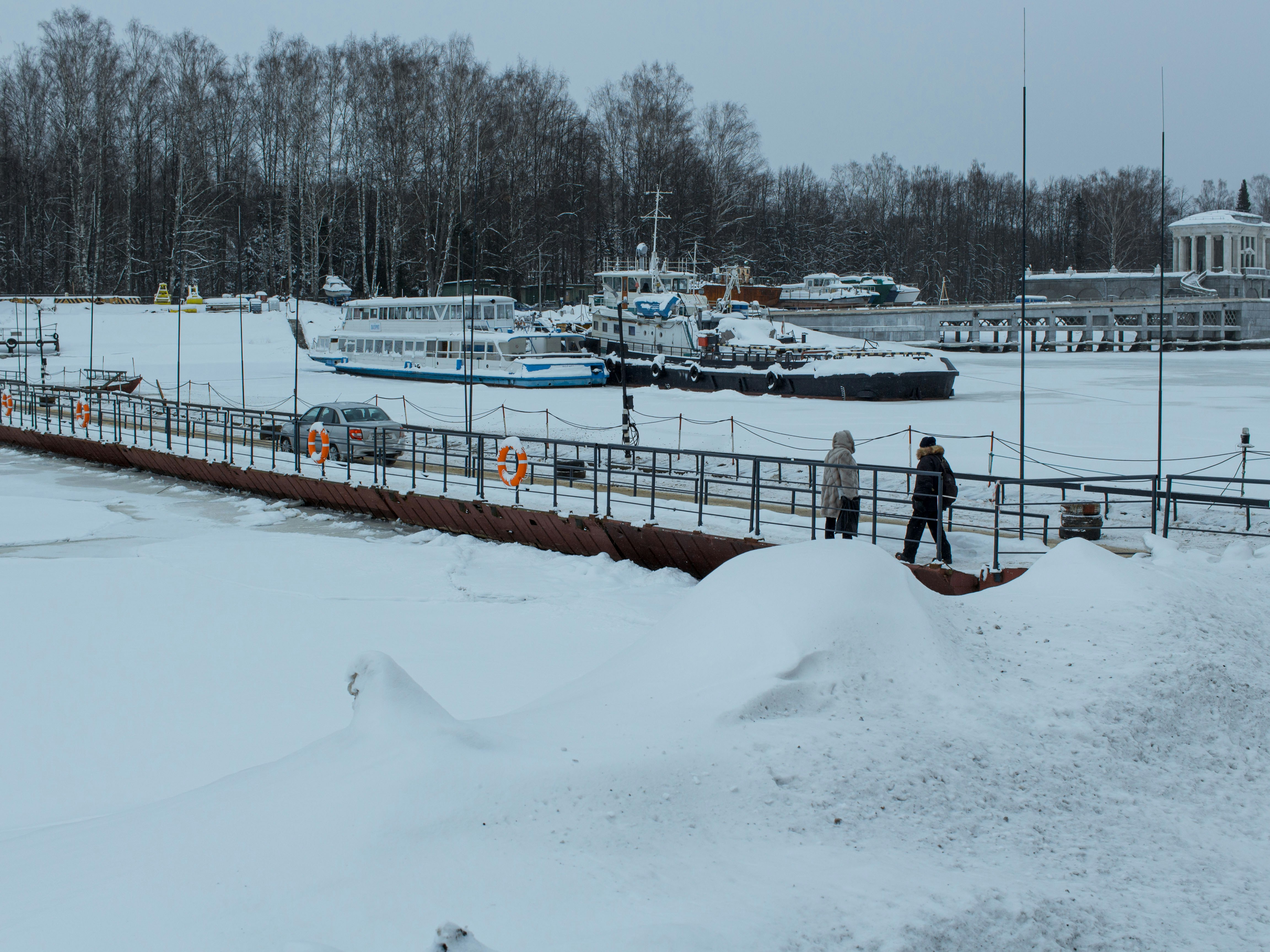 Snowbound Marina: Boats at Rest Beneath Winter Twilight