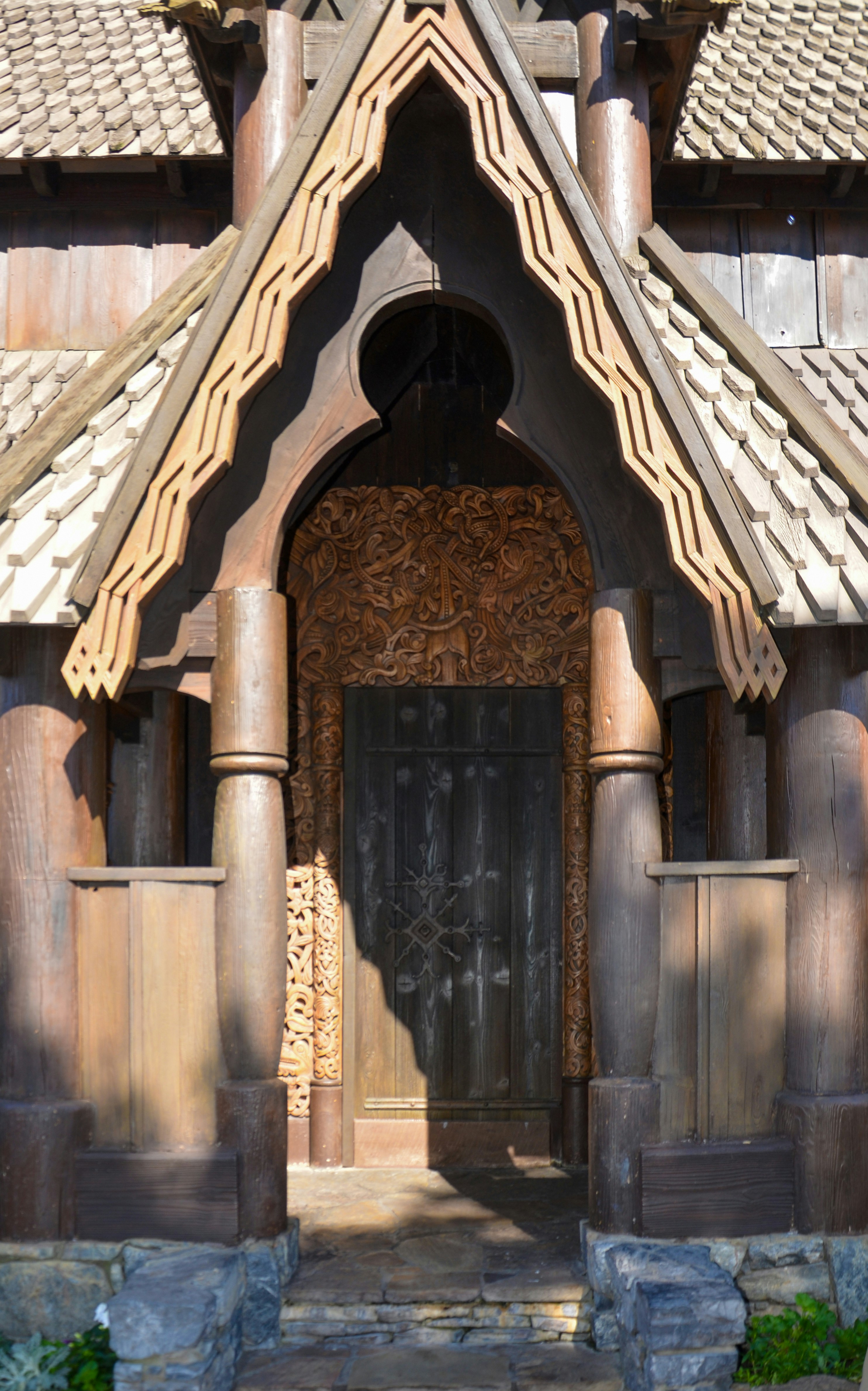 Carved Timber Portal: Central Door Framed by Stepped Gables