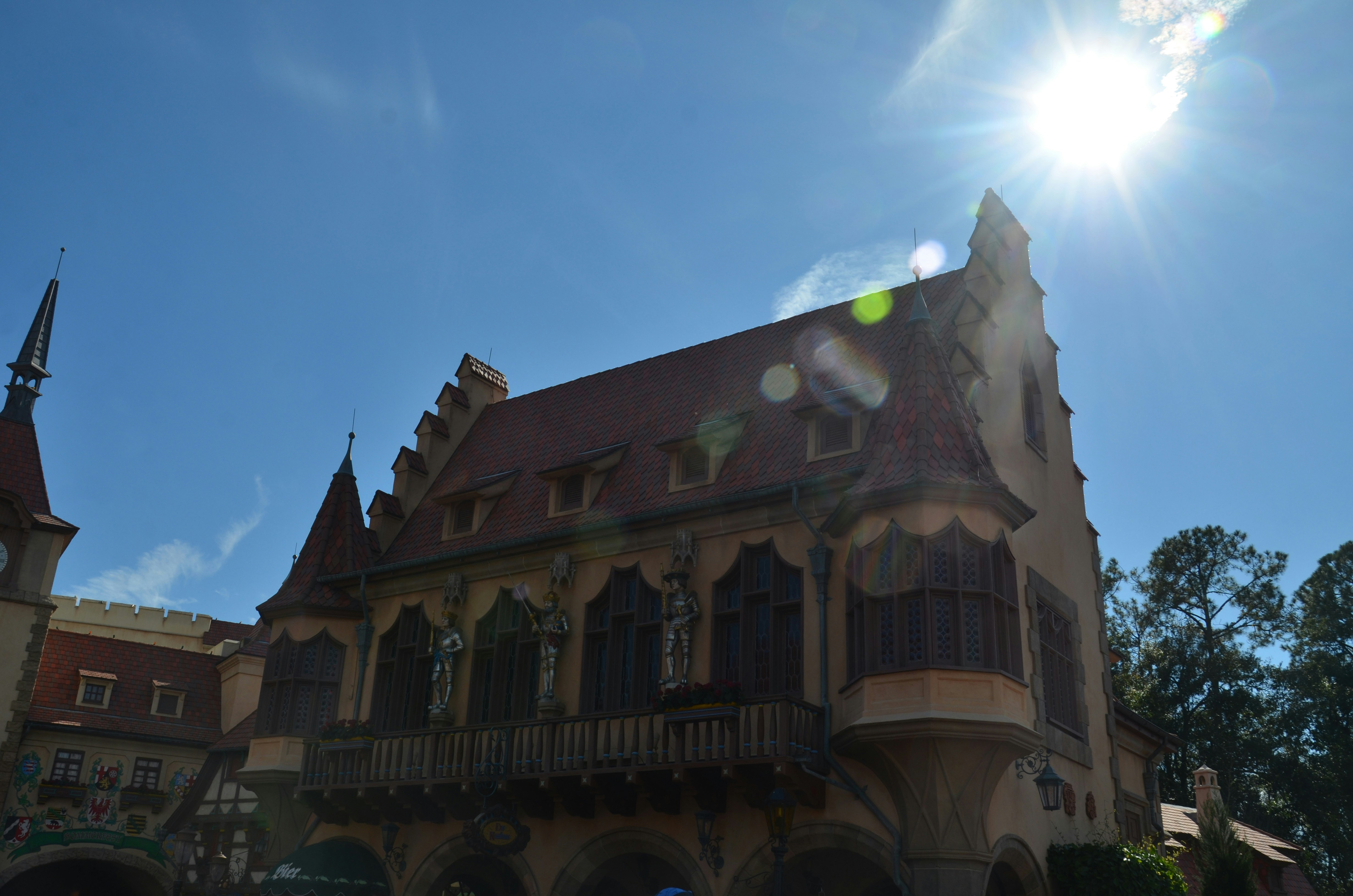 Noon Light on a Castle-Style Arcade: Stone Gables, Statues, and Arcades