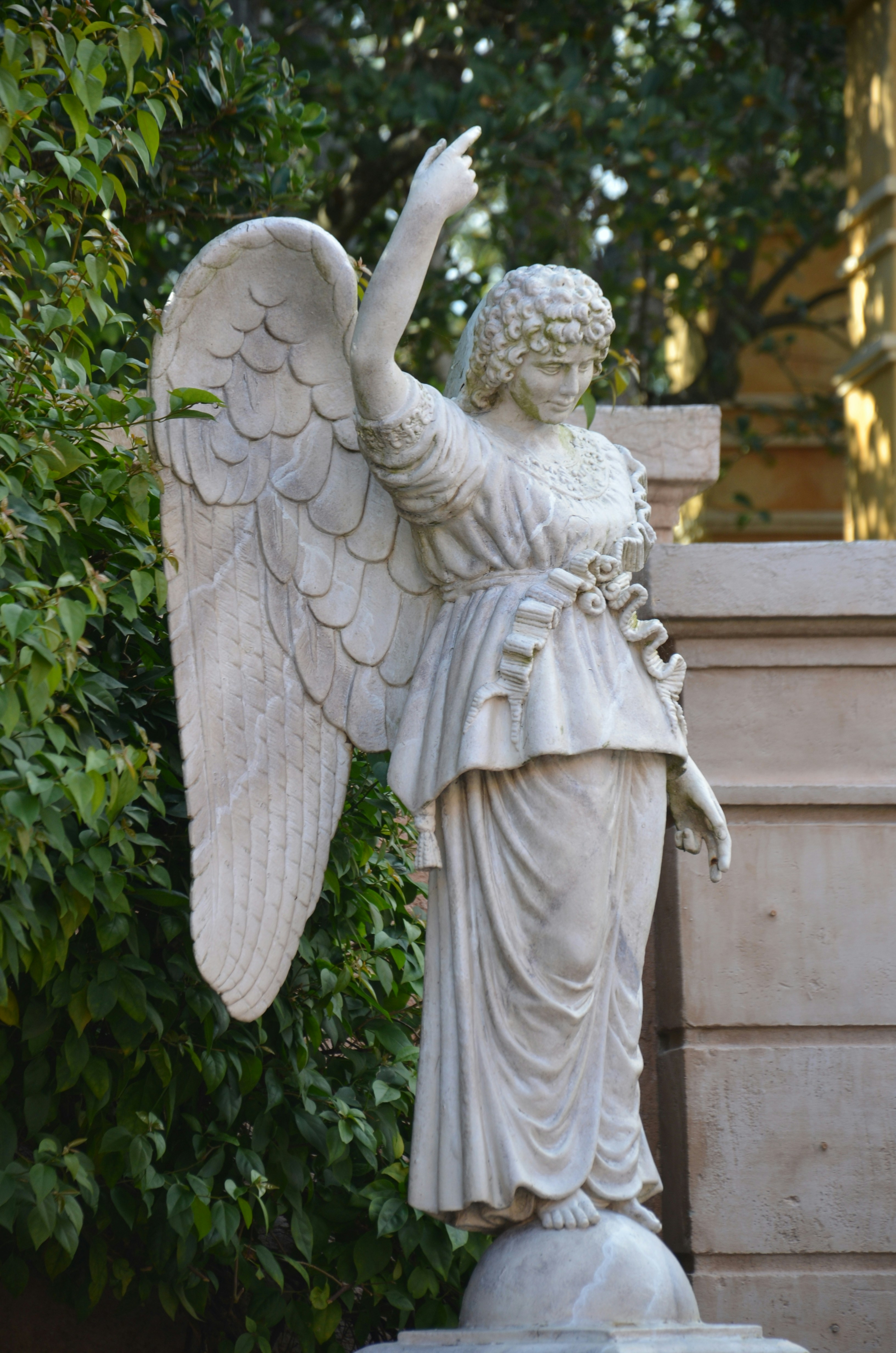 A statue of an angel holding a bird photo – Free Angel Image on Unsplash