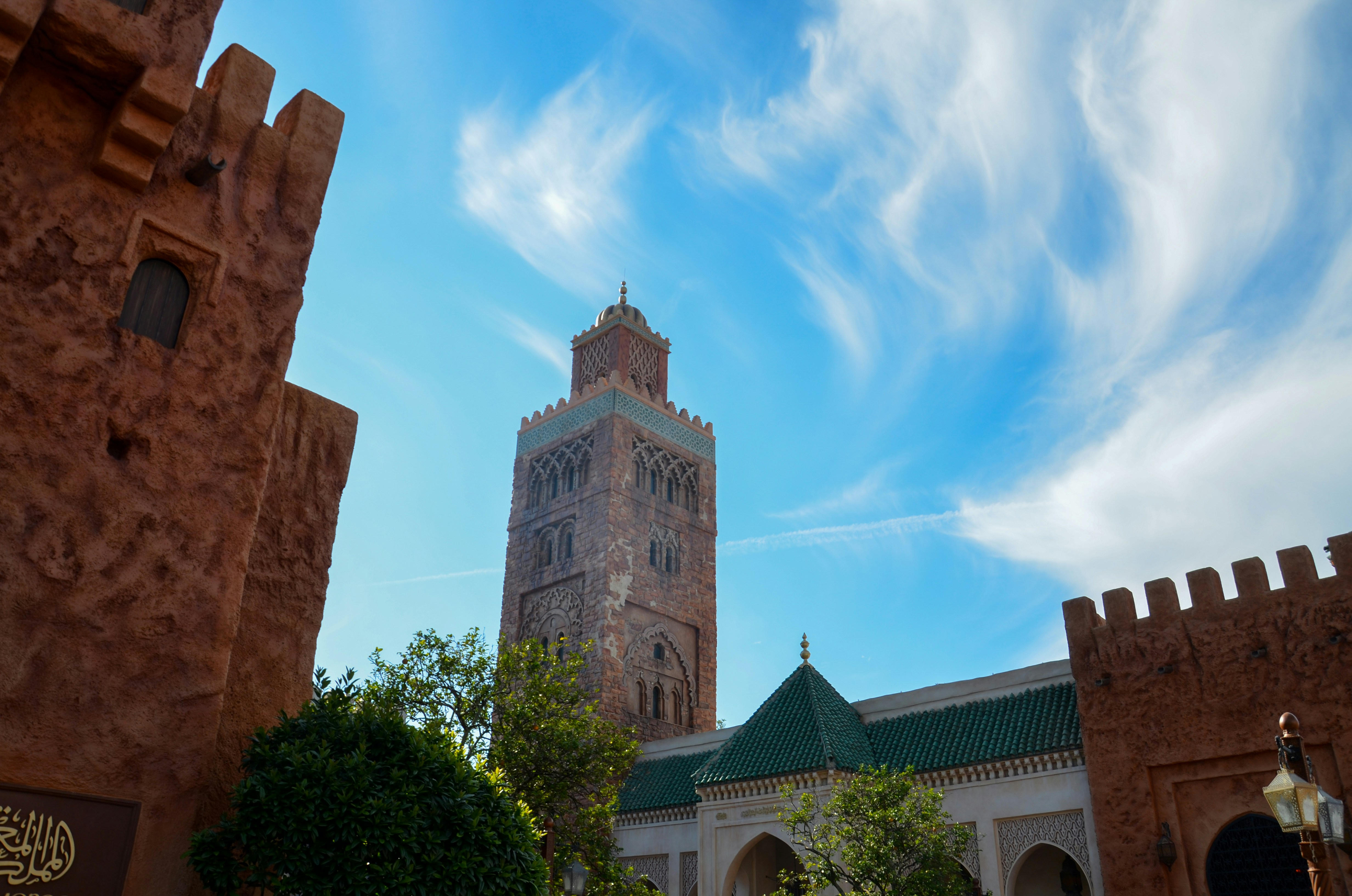Tower Rising Through Crimson Walls under a Cerulean Sky