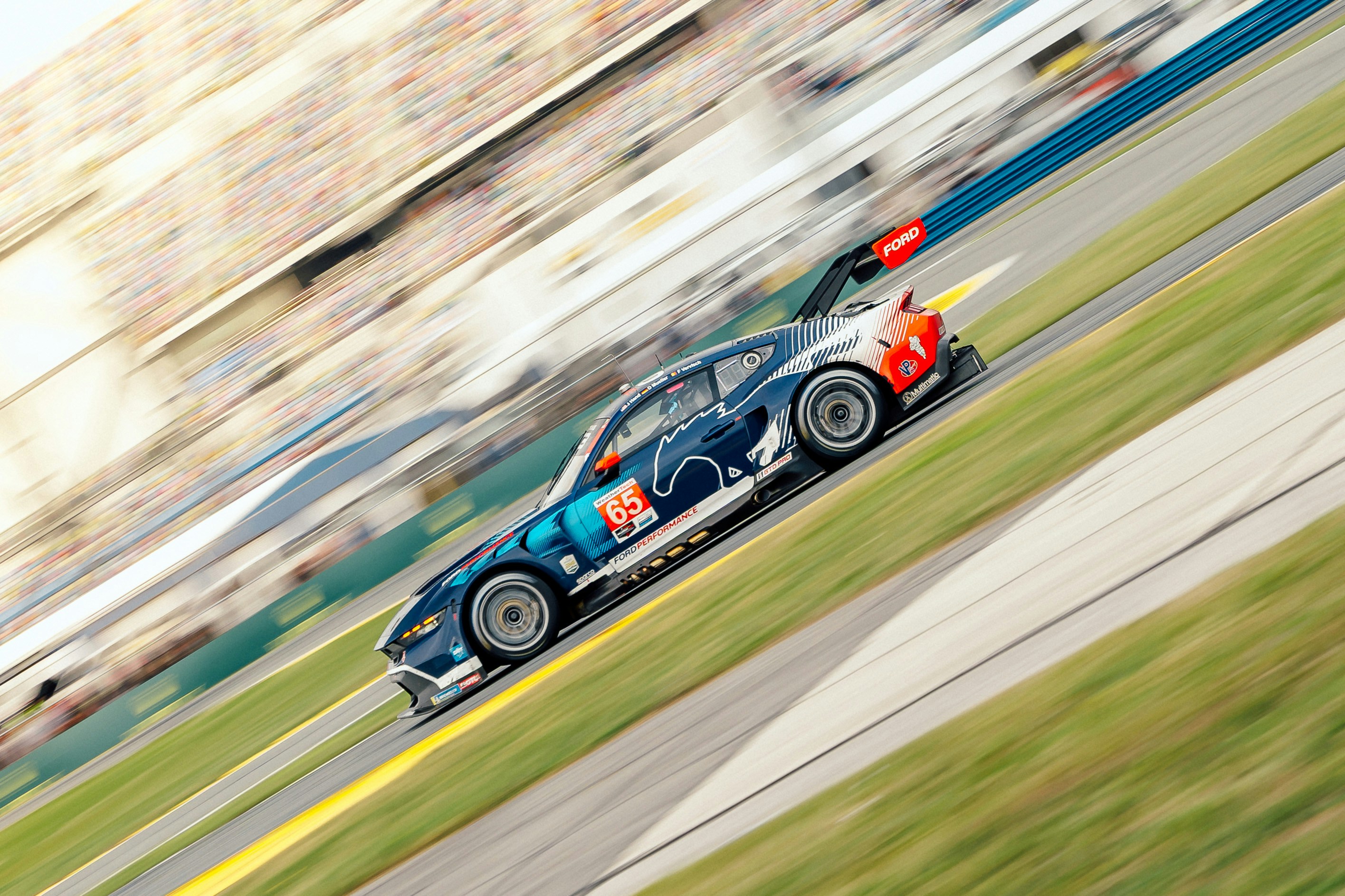 A race car driving down a race track photo – Free United states Image ...