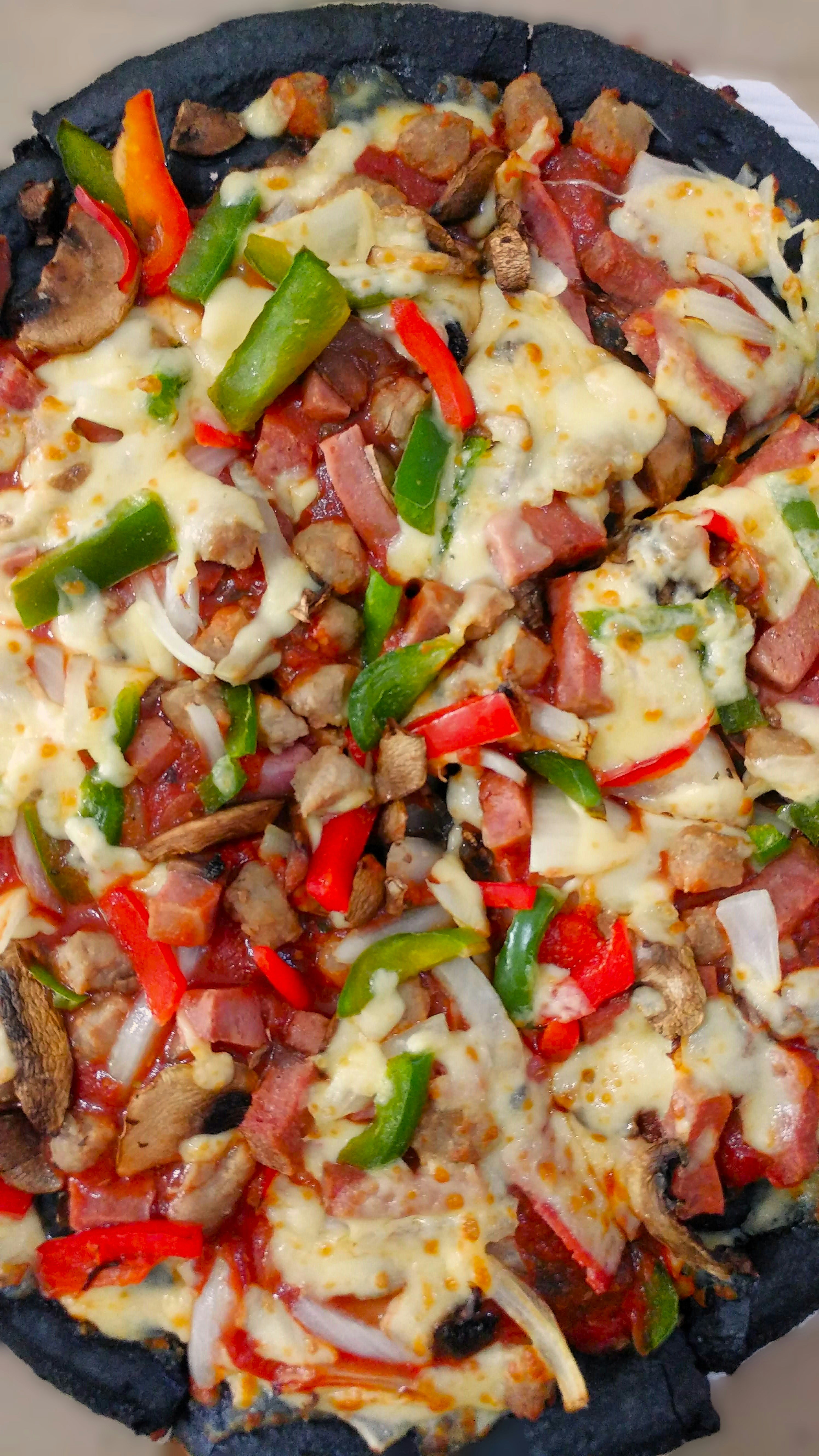 A pizza topped with lots of different toppings photo – Free Pizza hut ...
