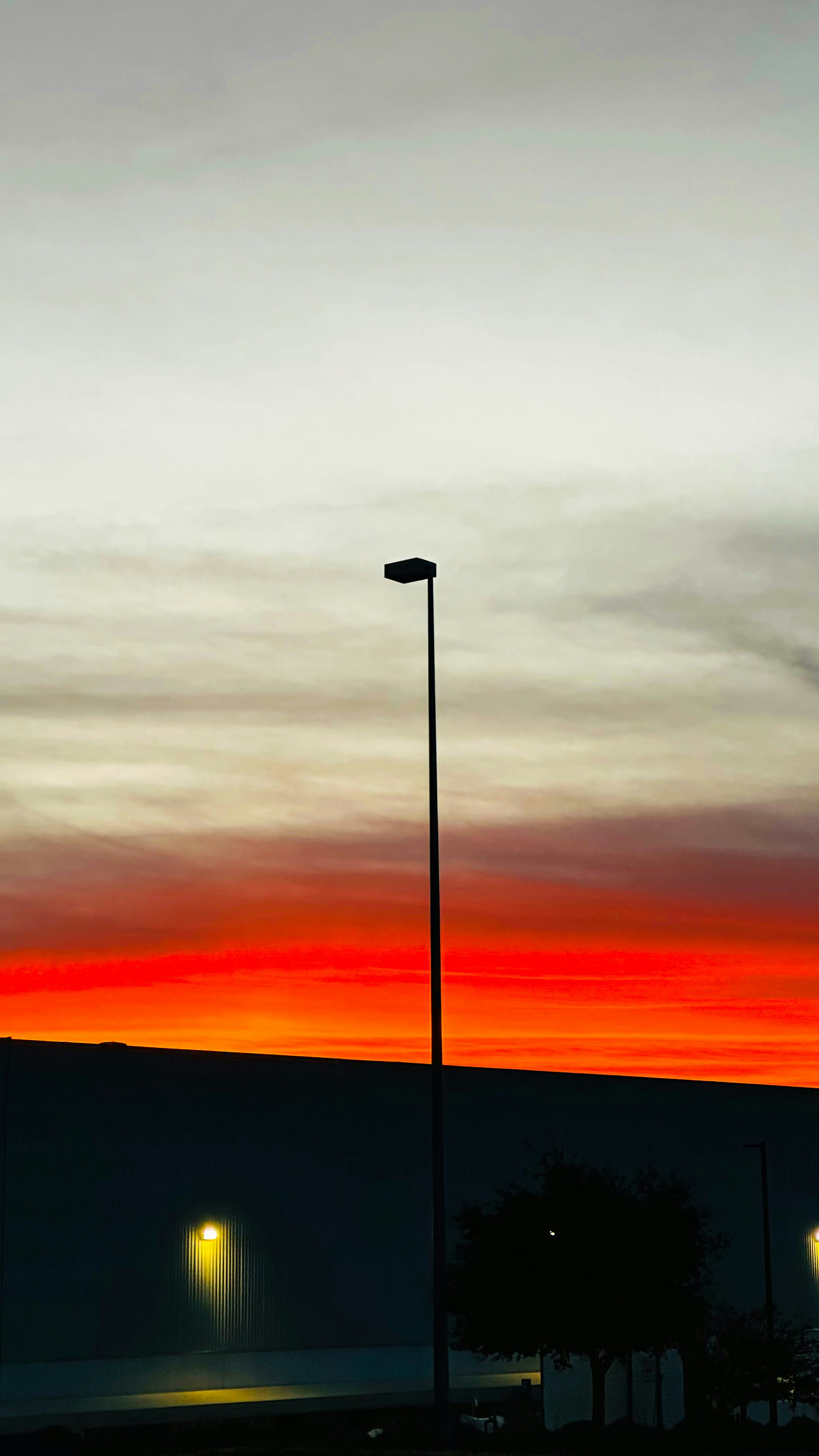 Crimson Horizon and the Lone Streetlight