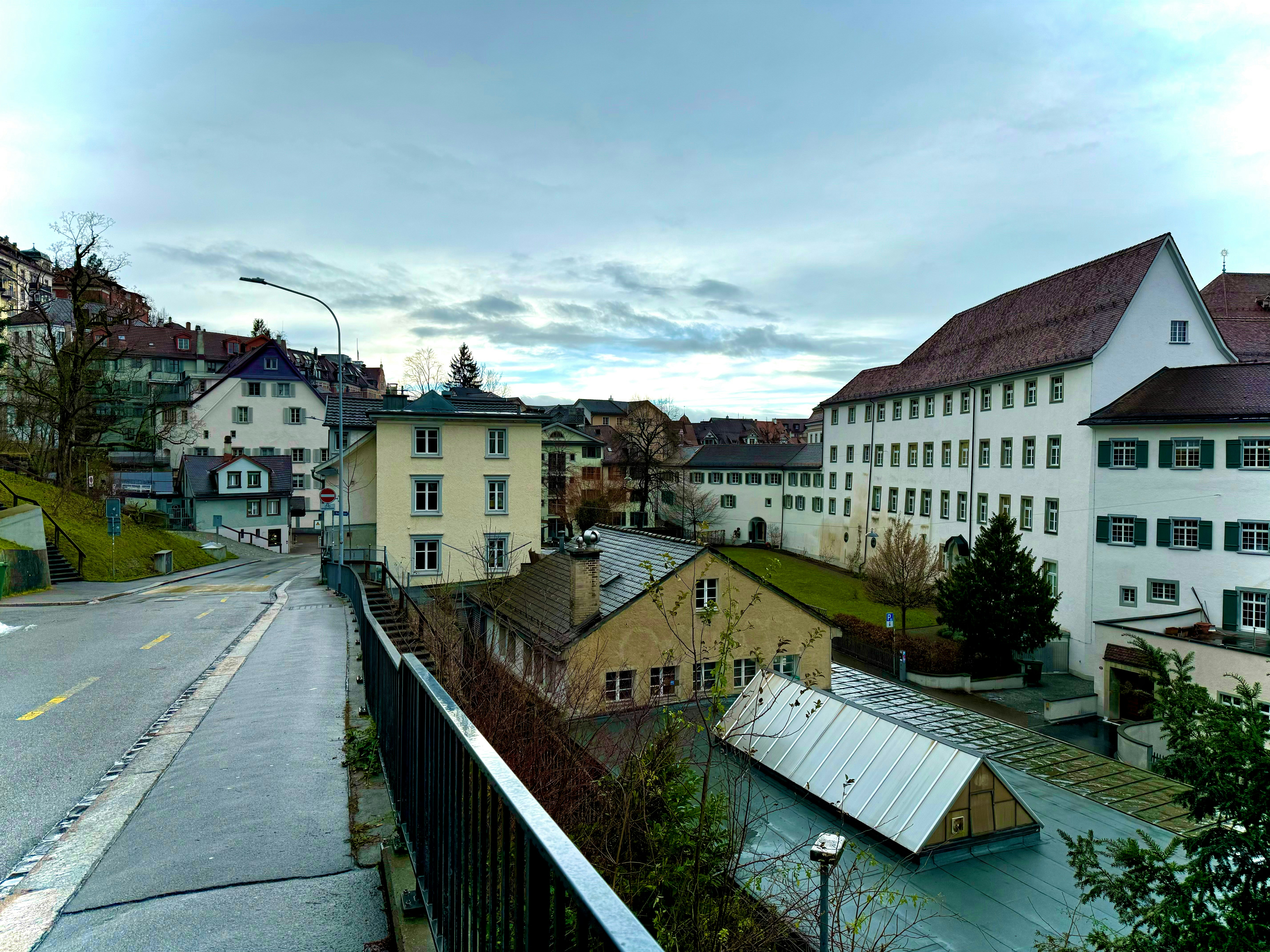 Sloping Street Corridor Framing a Quiet Town