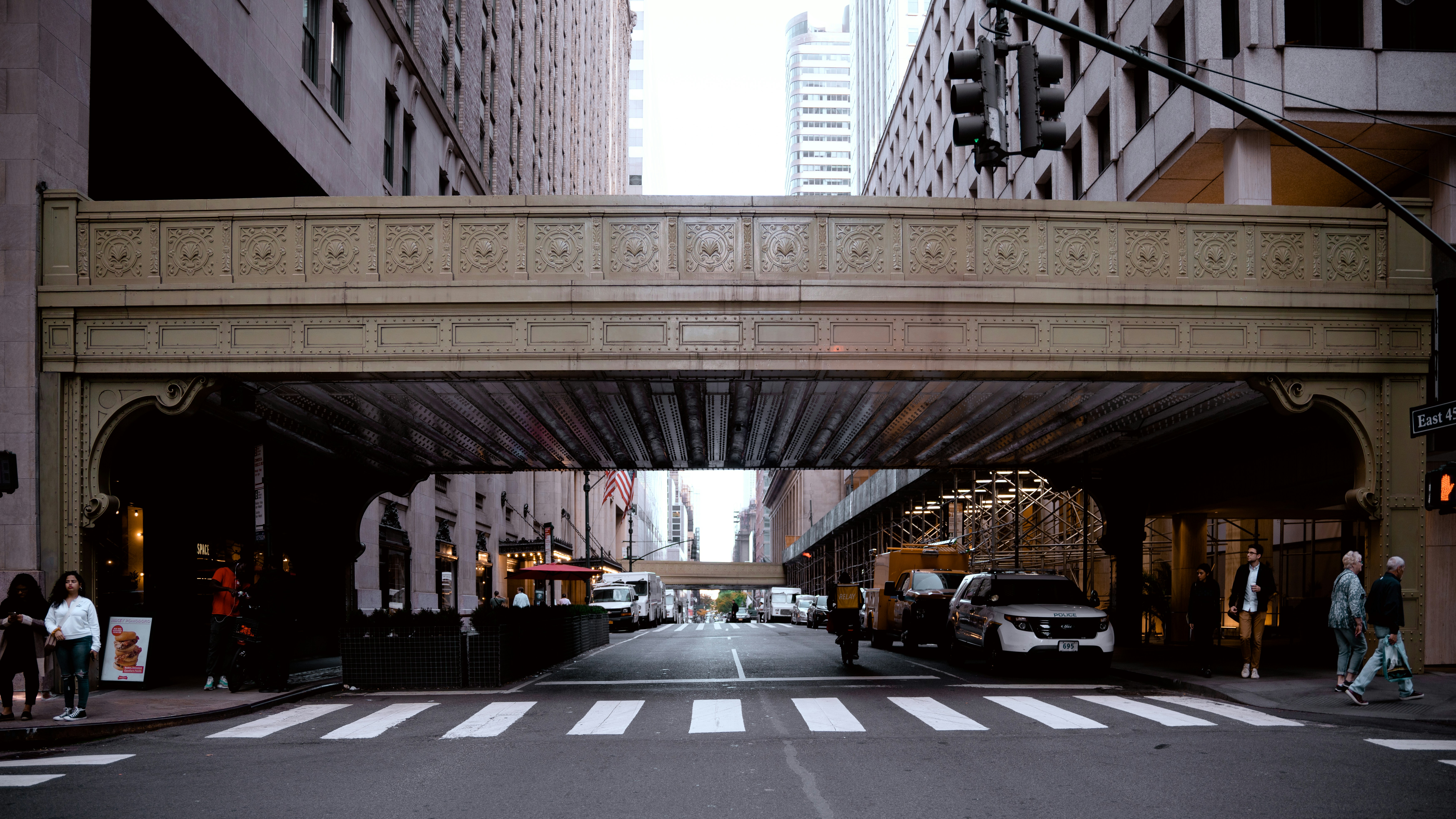 Urban Convergence: Crosswalks and the Bridge Framing a Distant City Arc