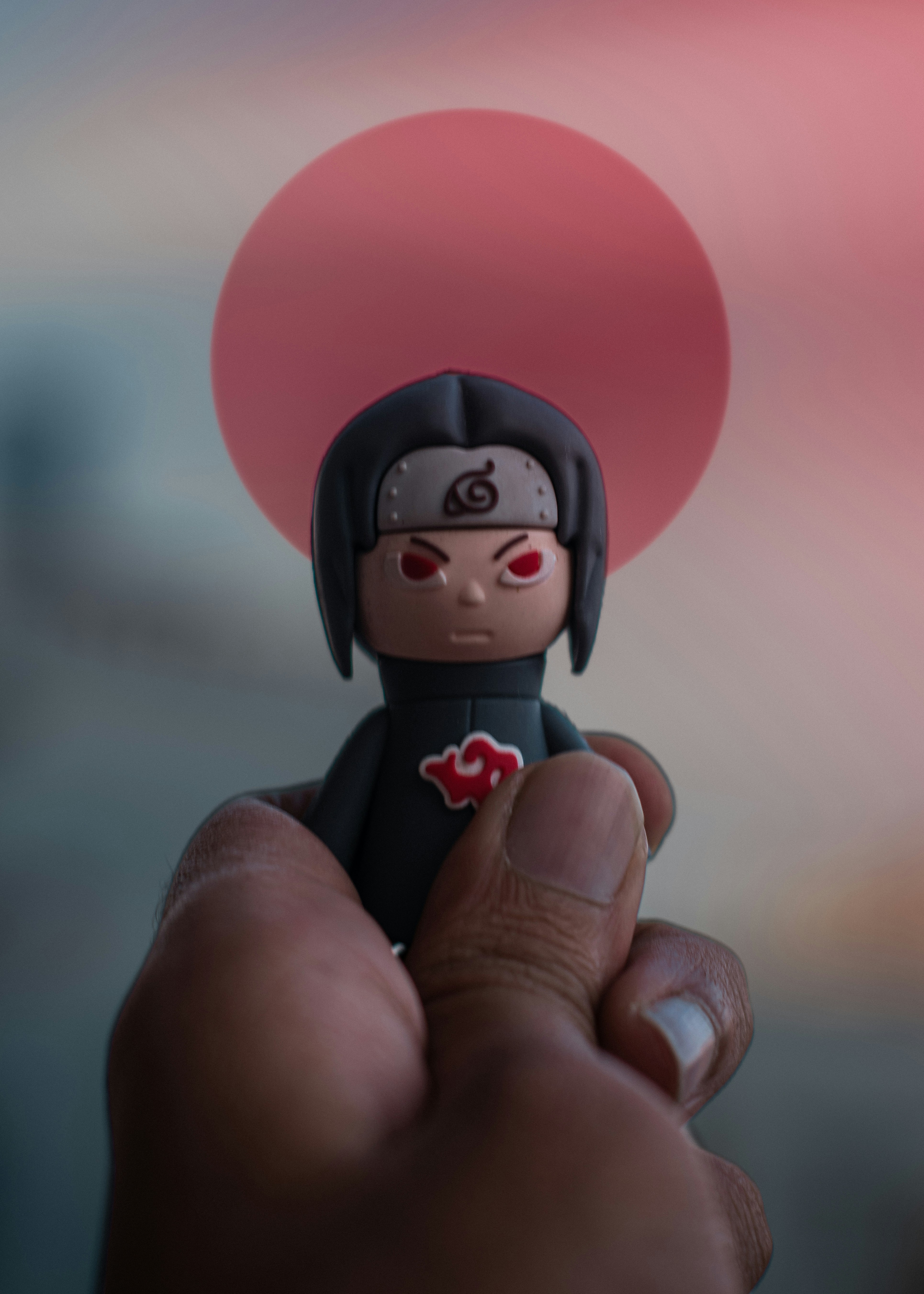 A person holding a tiny toy in their hand photo – Free Toy Image on ...