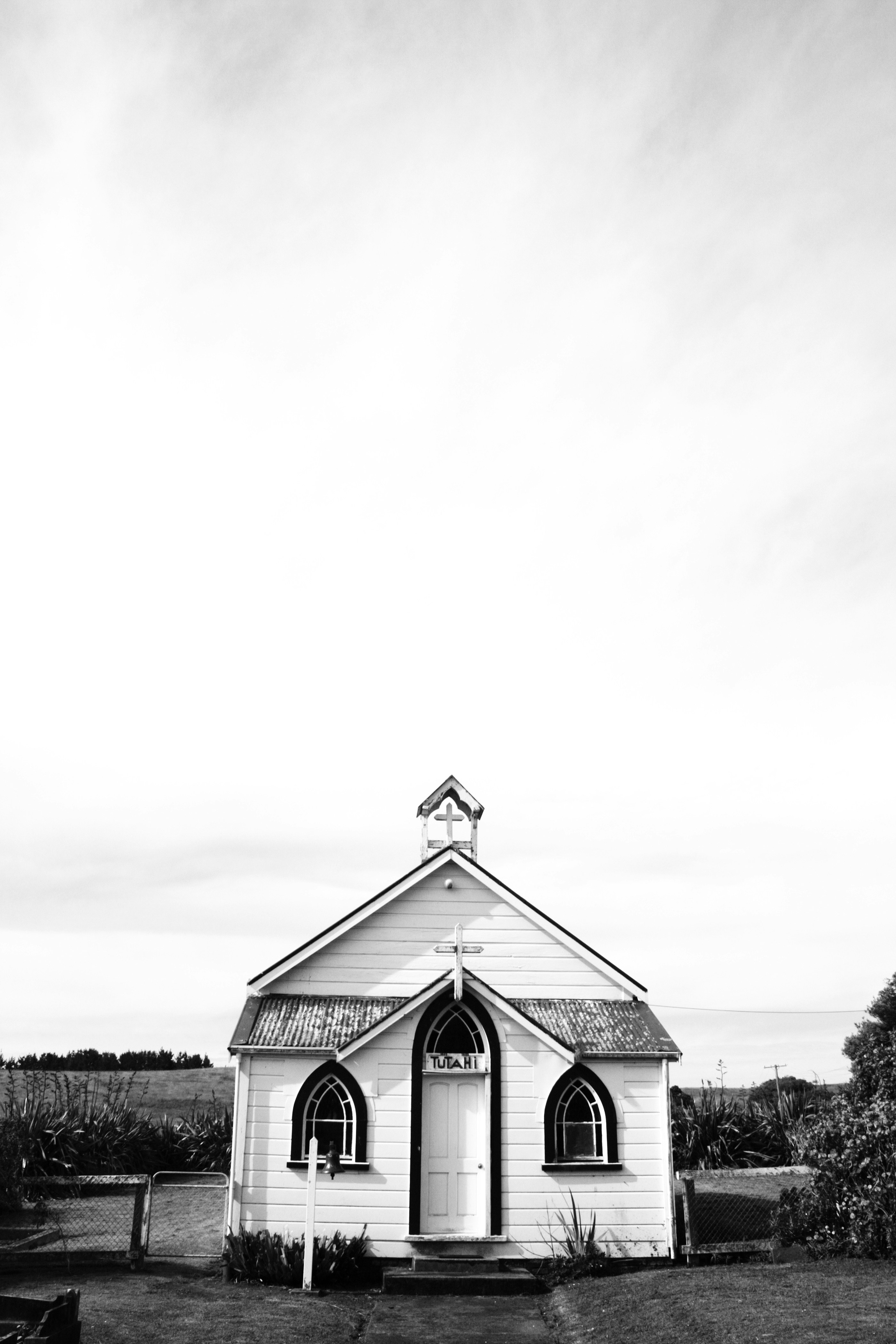 Tiny White Chapel Under an Expansive Sky