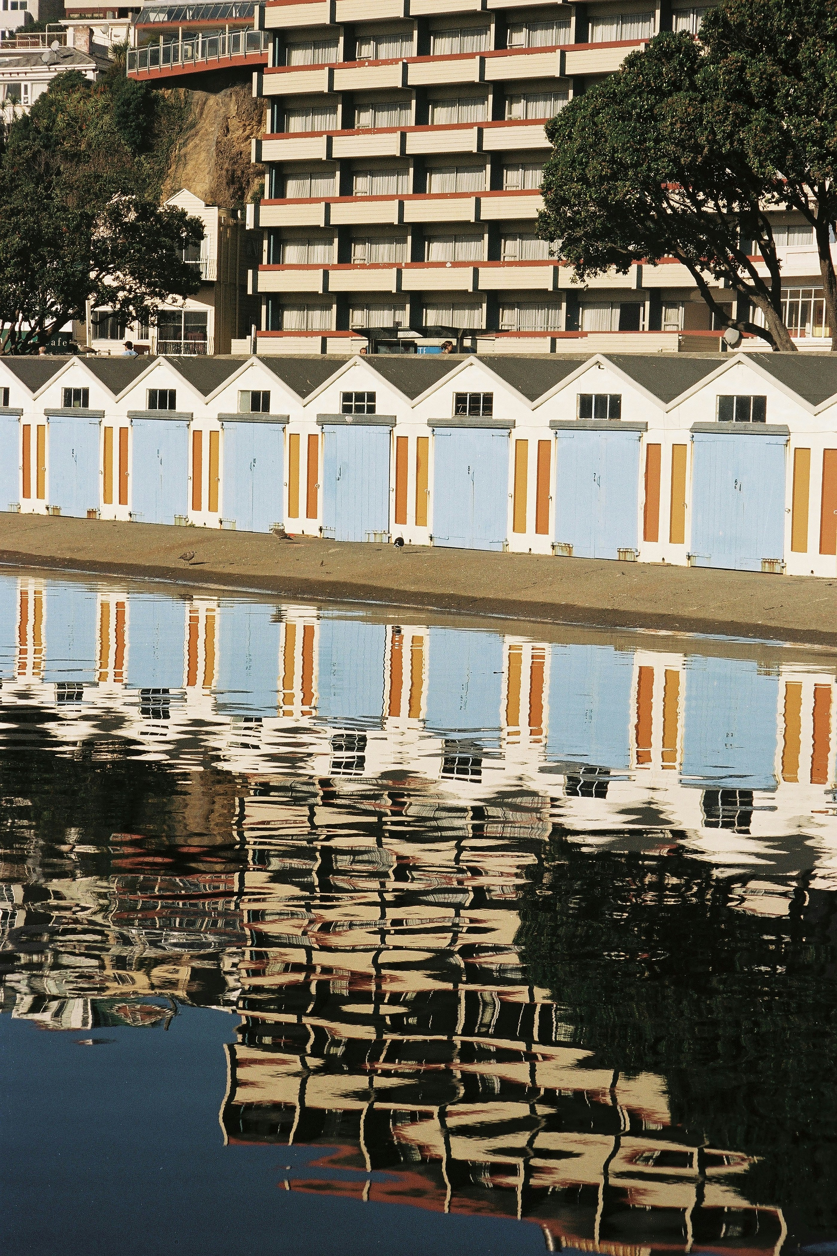 a large body of water with a building in the background