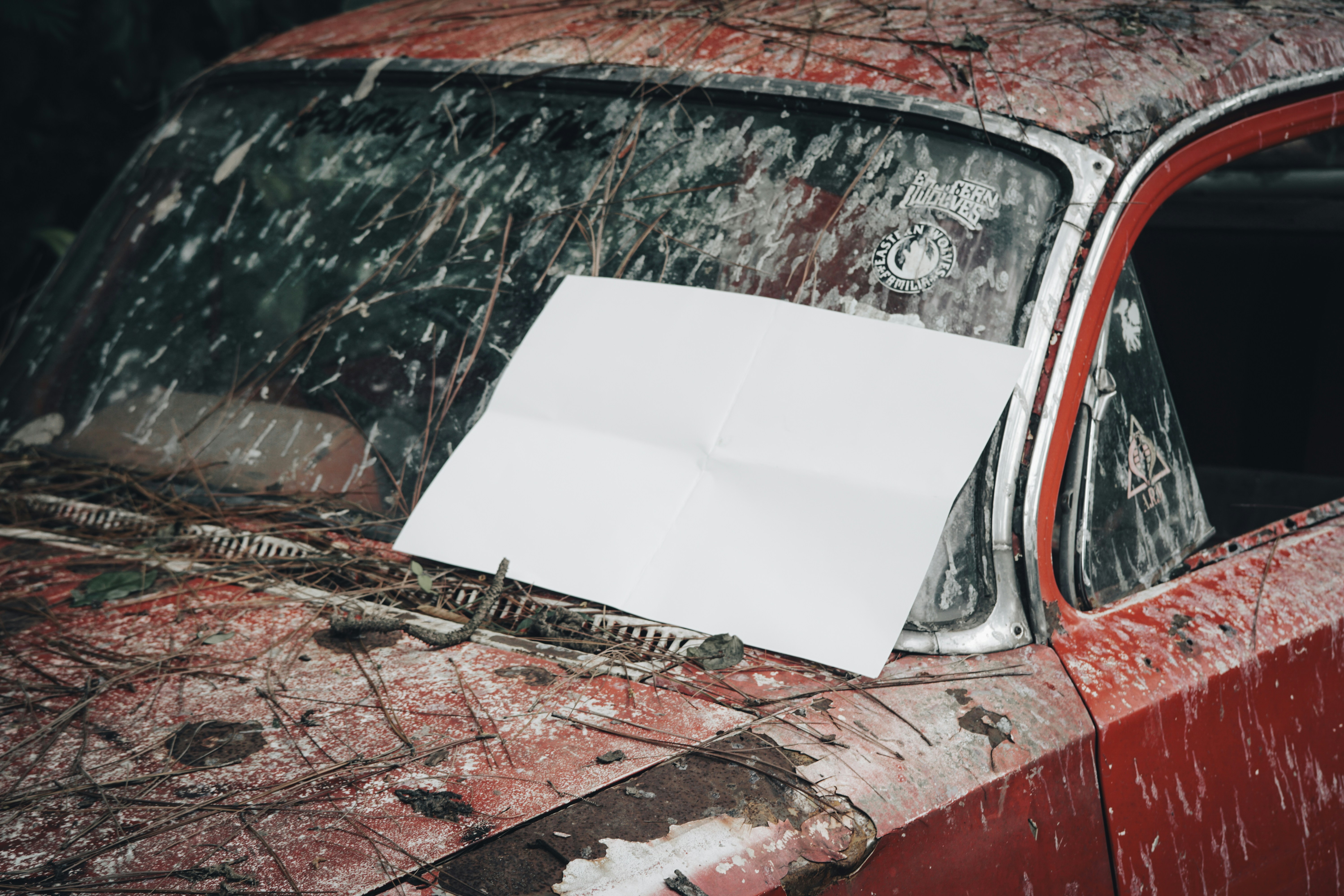 An old red car with a piece of paper stuck to the windshield photo ...
