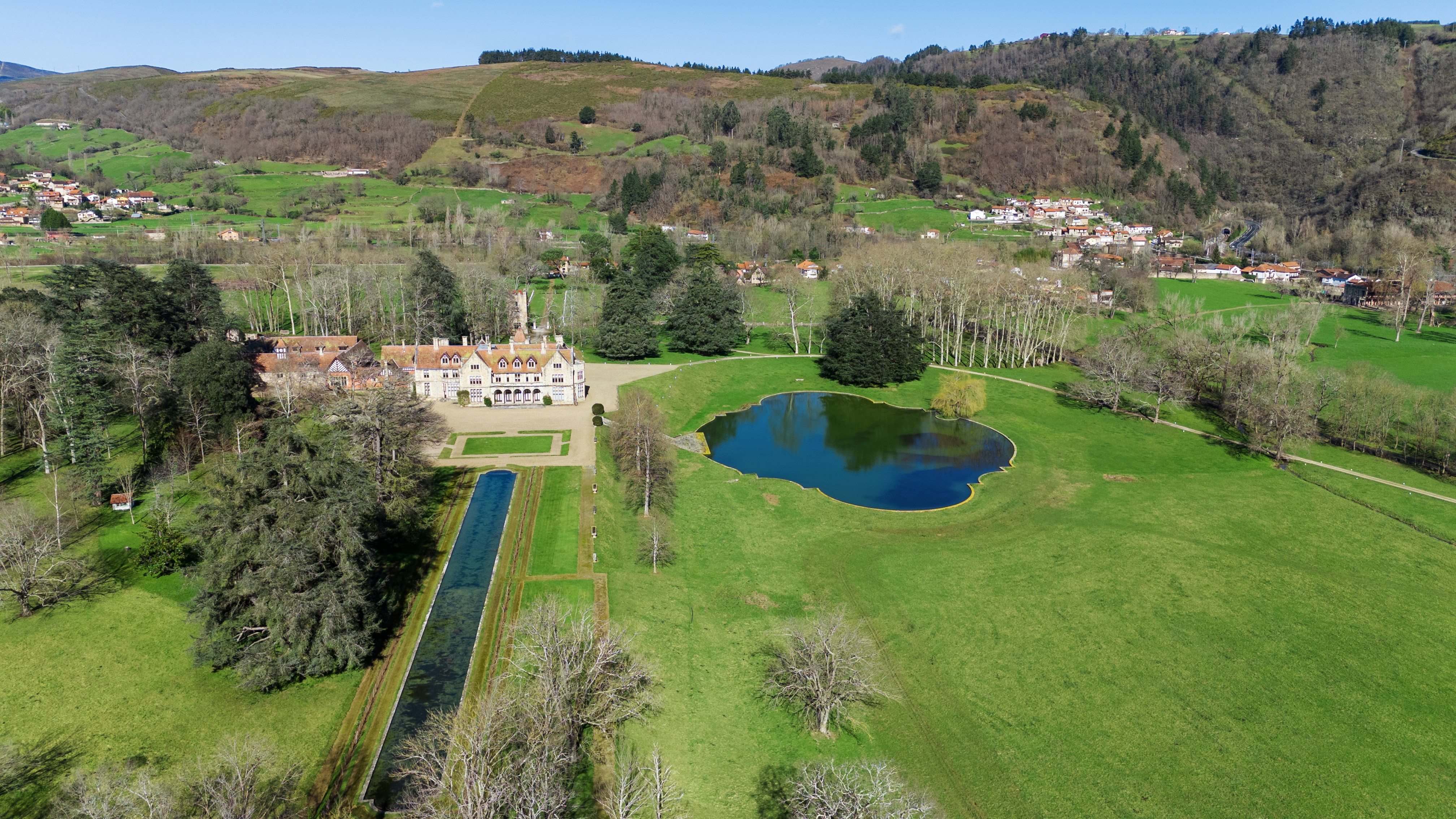 Aerial View of a Serene Estate with Reflective Pond