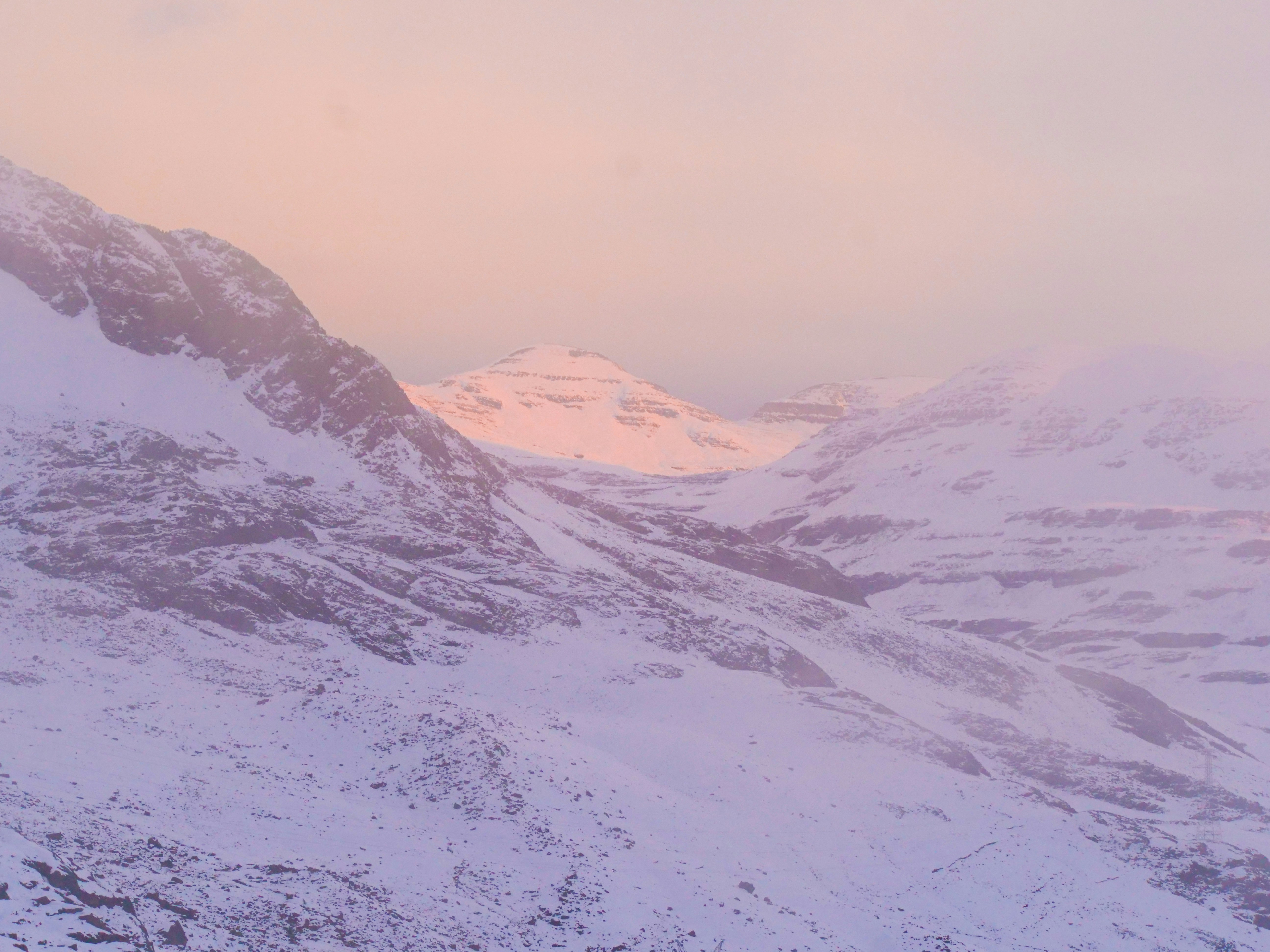 Dawn's Ember Crown over a Snowbound Alpine Range