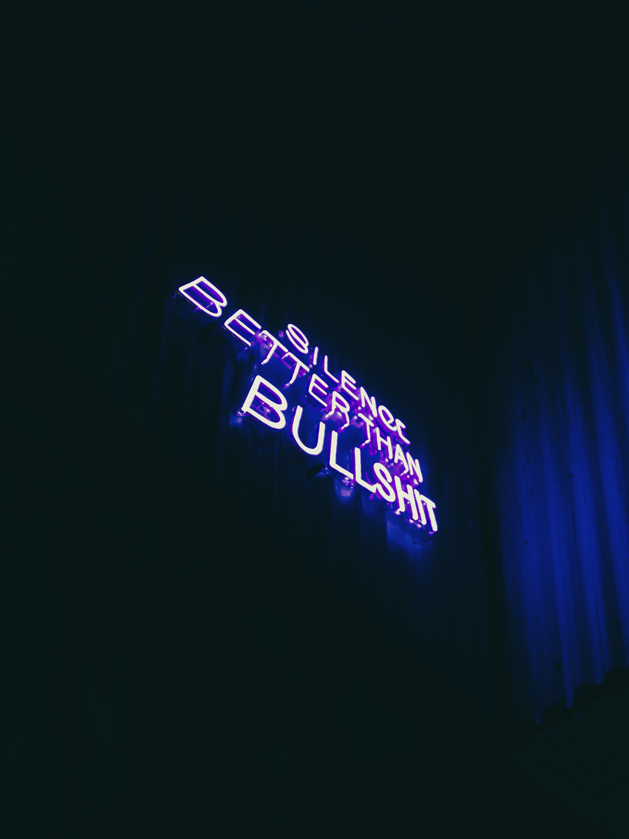 Blue Neon Confession on a Dark Curtain Stage