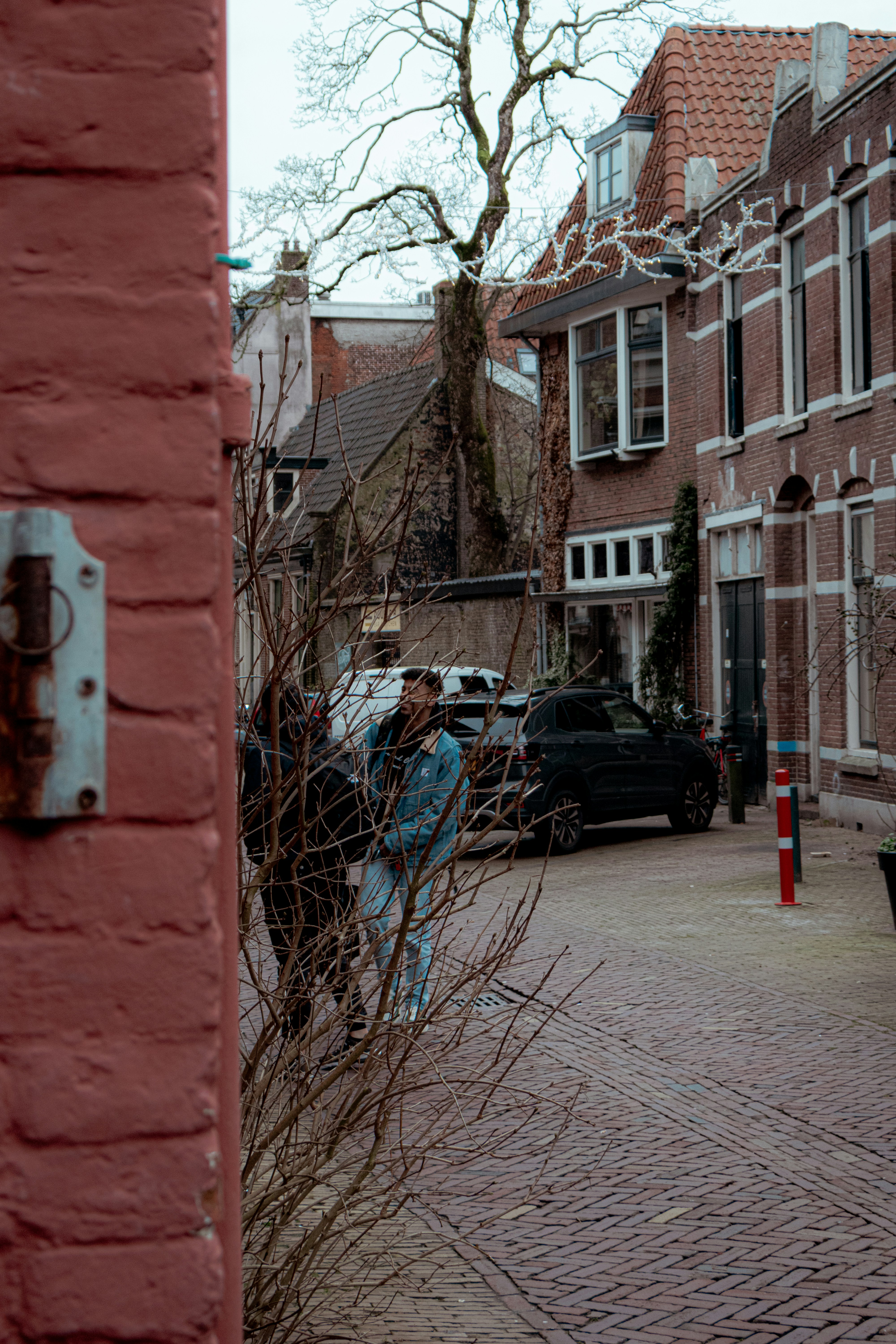 Hidden Figure Between the Brick Facades