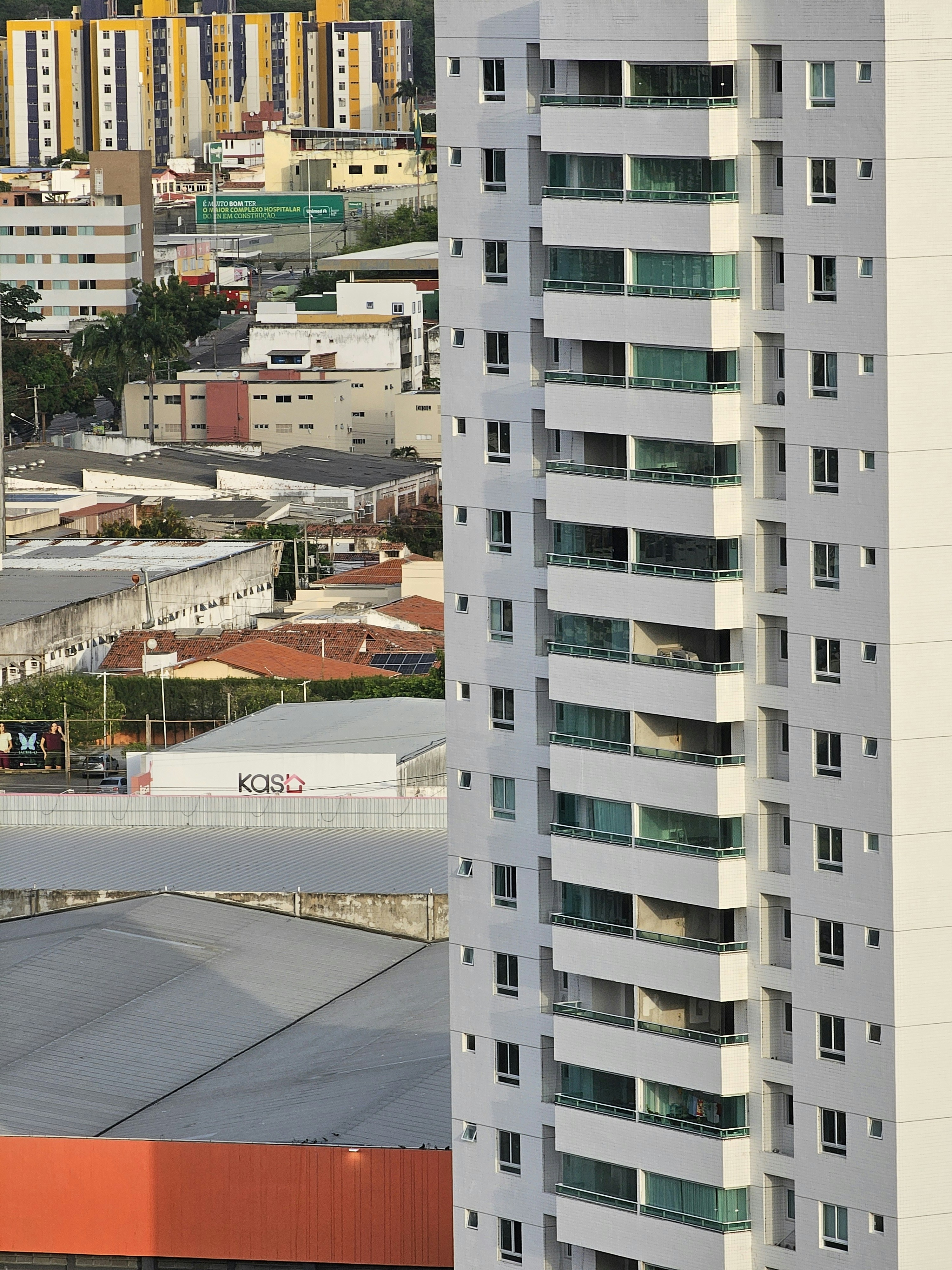 Balcony Echoes: A Vertical Cityscape Framed by Colorful Blocks