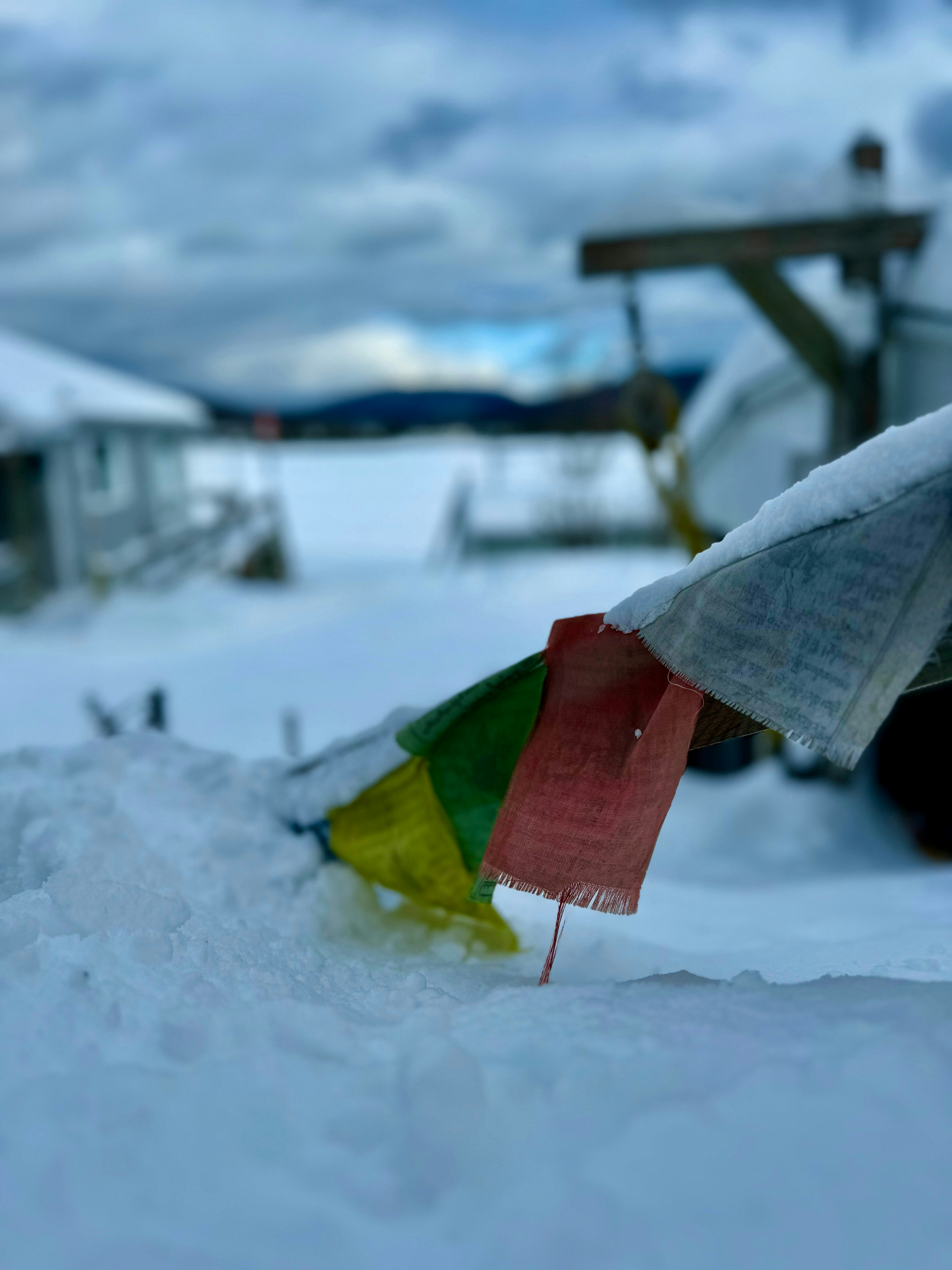 Snowbound Prayer Flags on a Quiet Nordic Porch