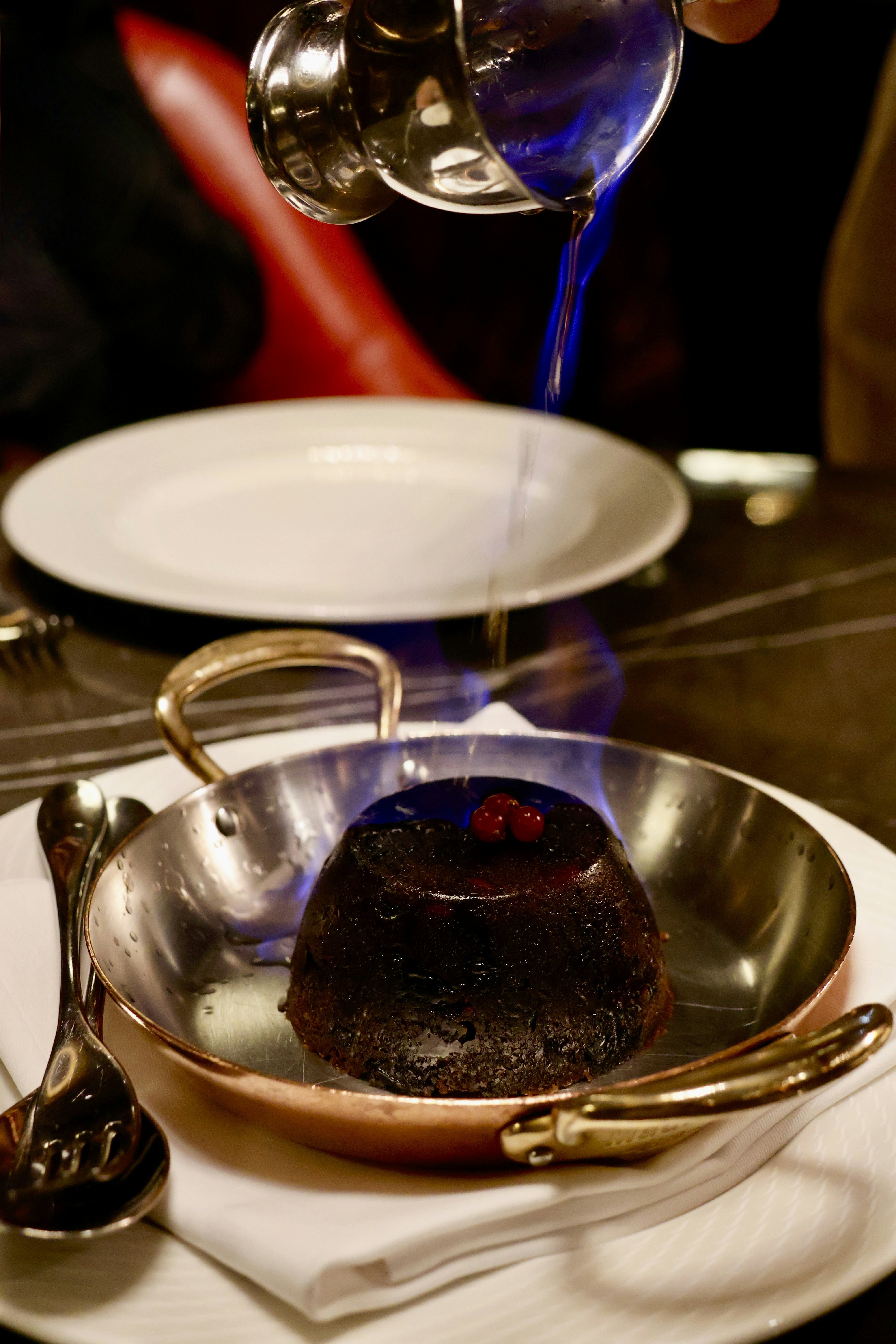 Charred Chocolate Dome Serenaded by Blue Flame at Center Table