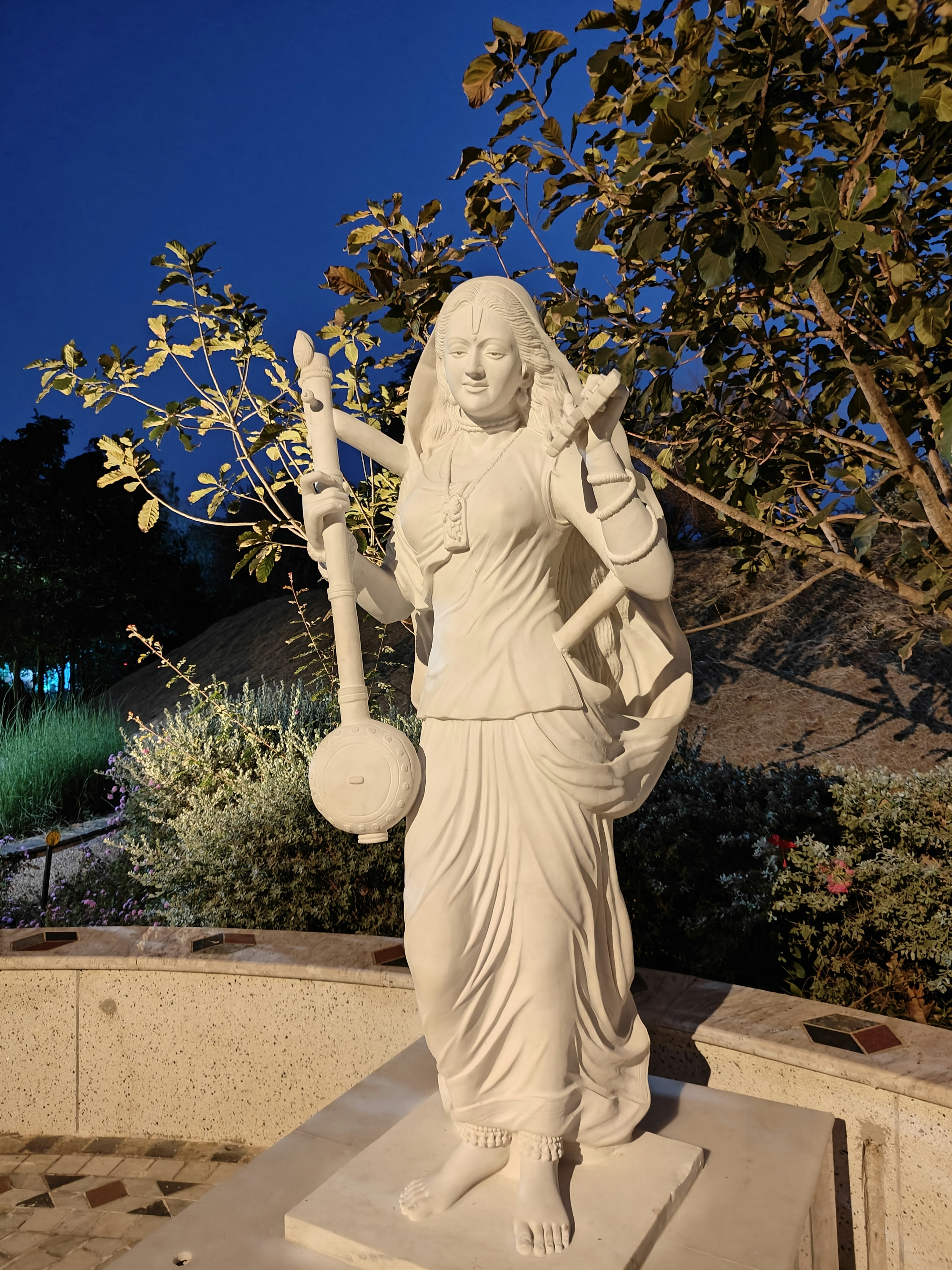 Veena-Wielding Saraswati in a Night Garden