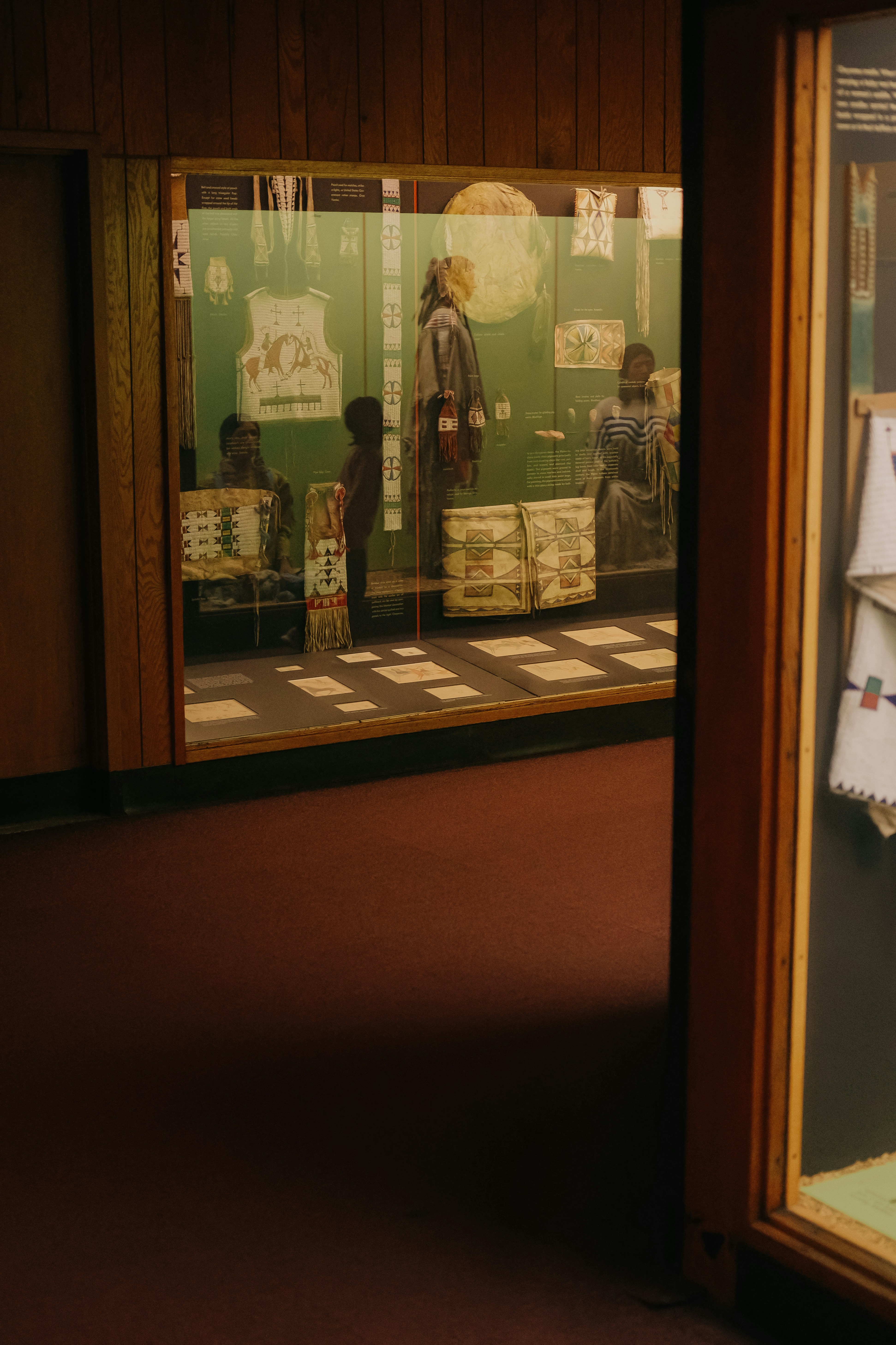 Threads Behind Glass: A Quiet Textile Exhibit Reflected