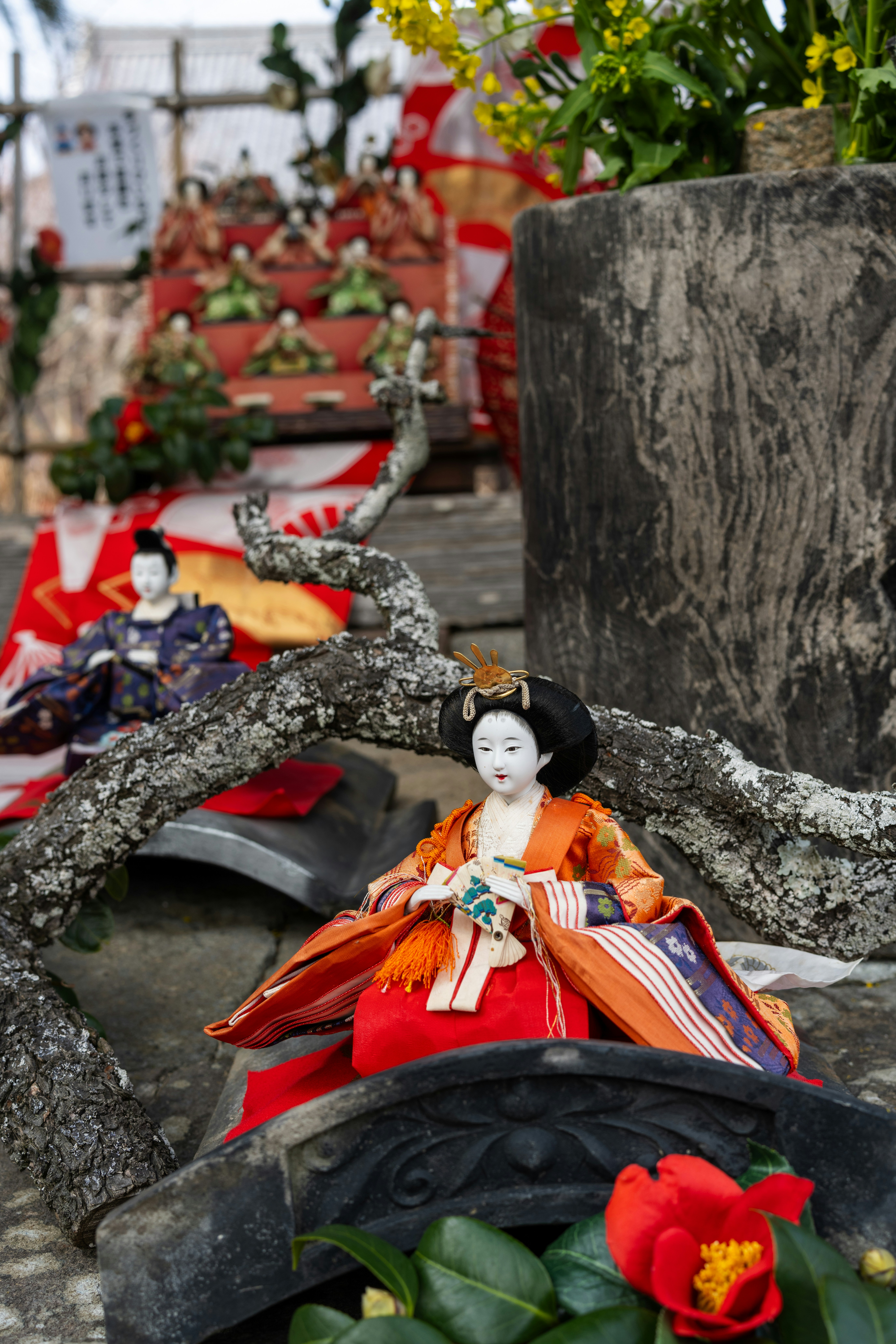 A statue of a woman sitting on top of a tree photo – Free Flower Image ...