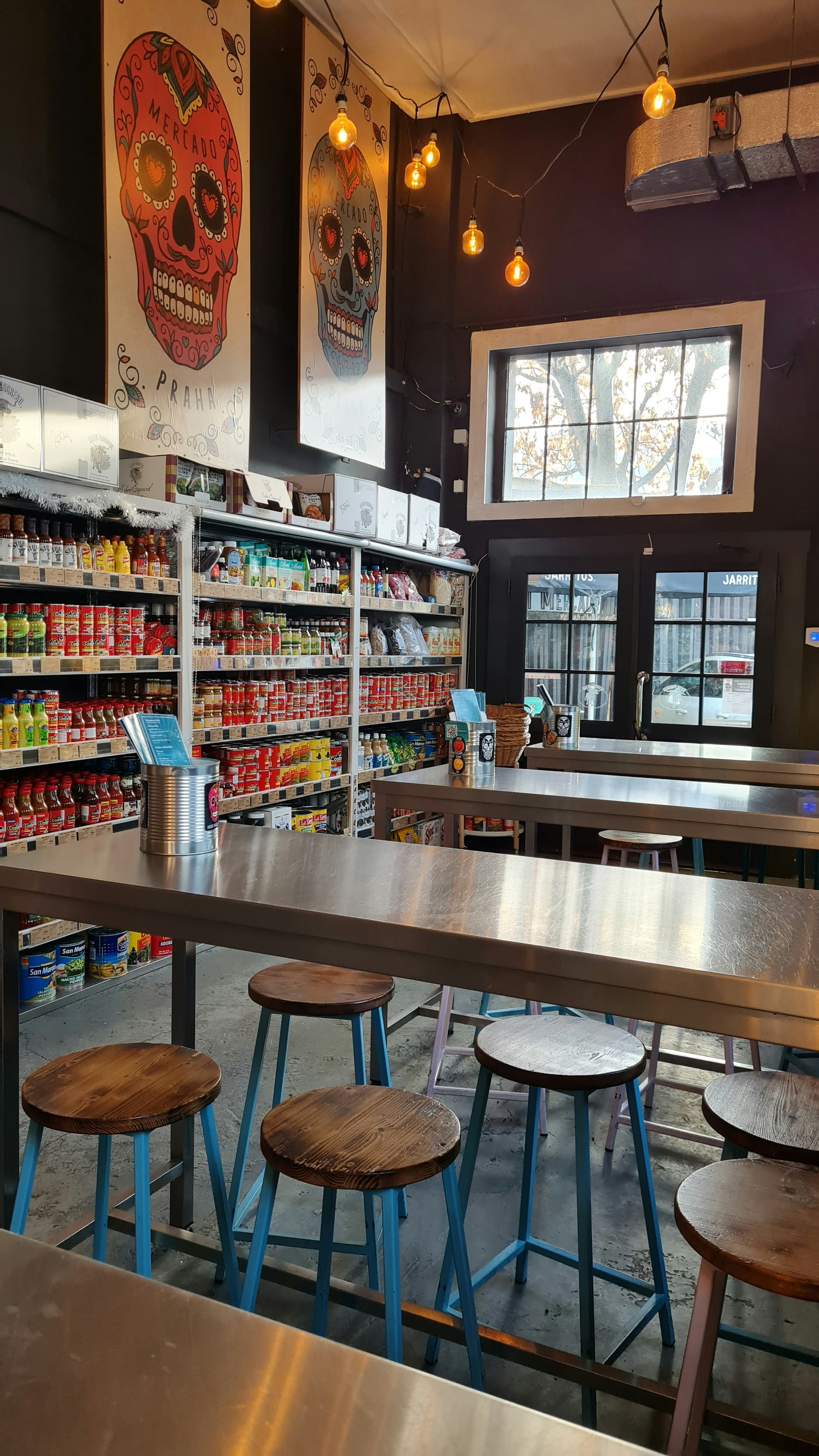 Skylit Neon: A Daylight Bar Inside a Colorful Market Café