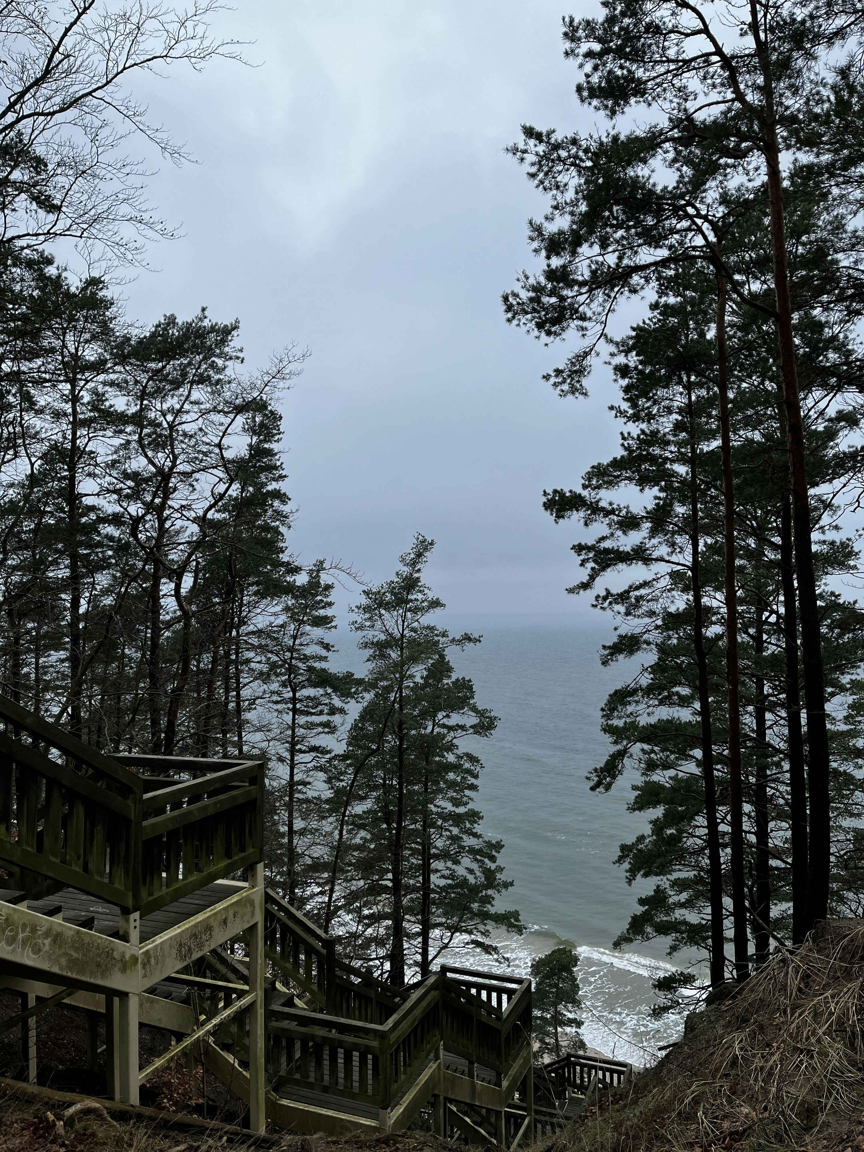Weathered Coastal Staircase Framing a Quiet Sea Horizon