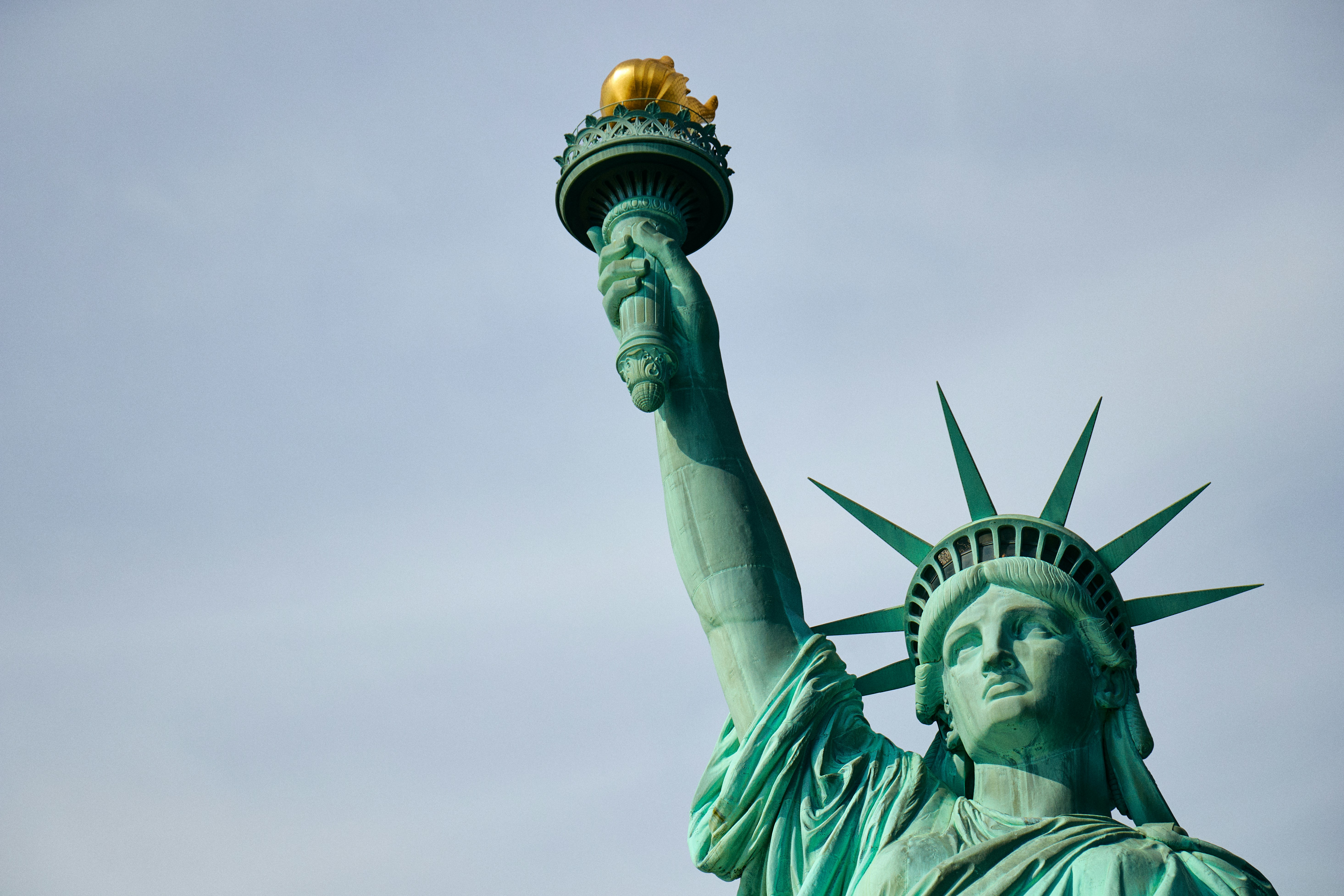 The statue of liberty has a golden crown on it's head photo – Free Art ...