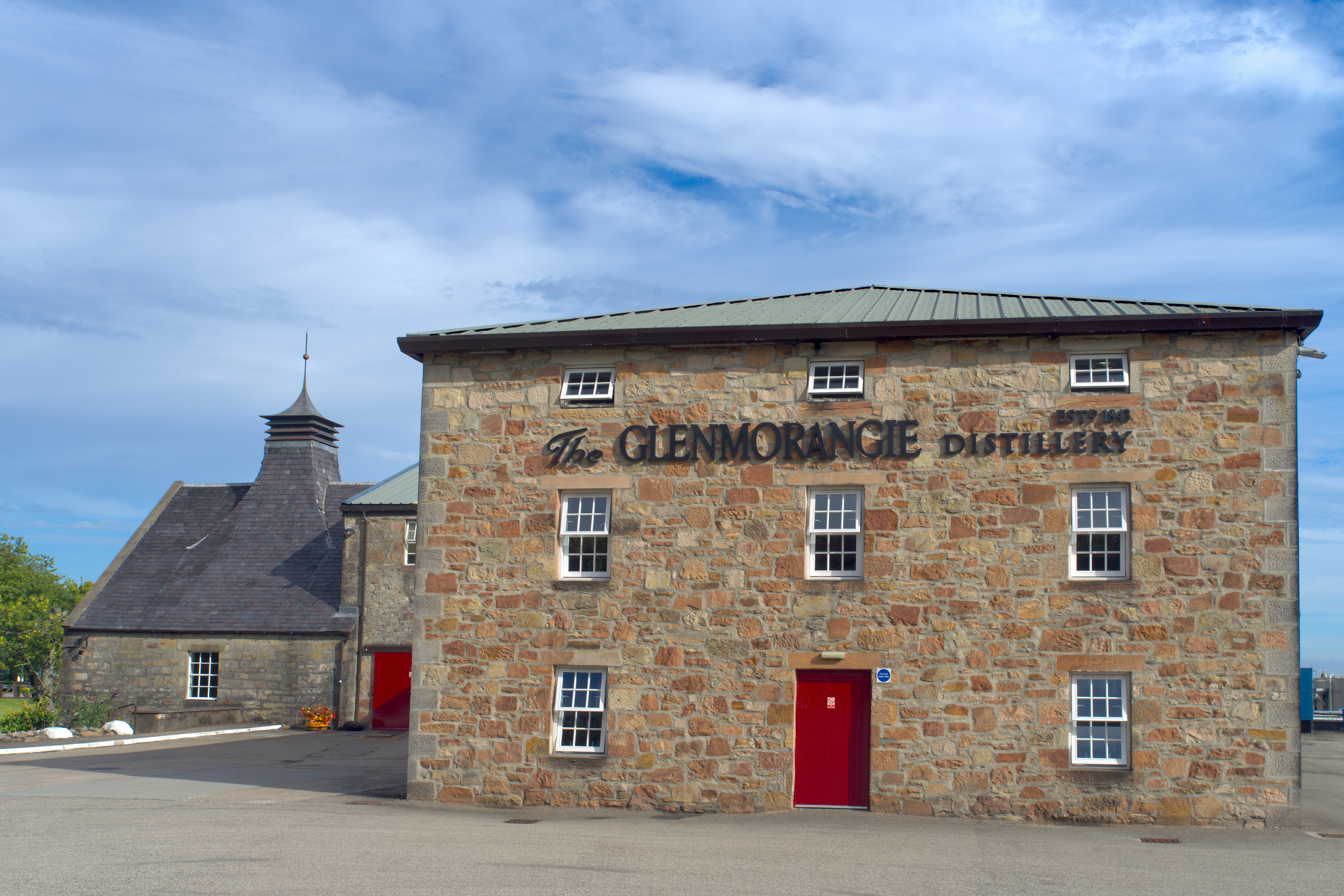 The Glenmorangie Distillery Facade: Stonework and Red Doors