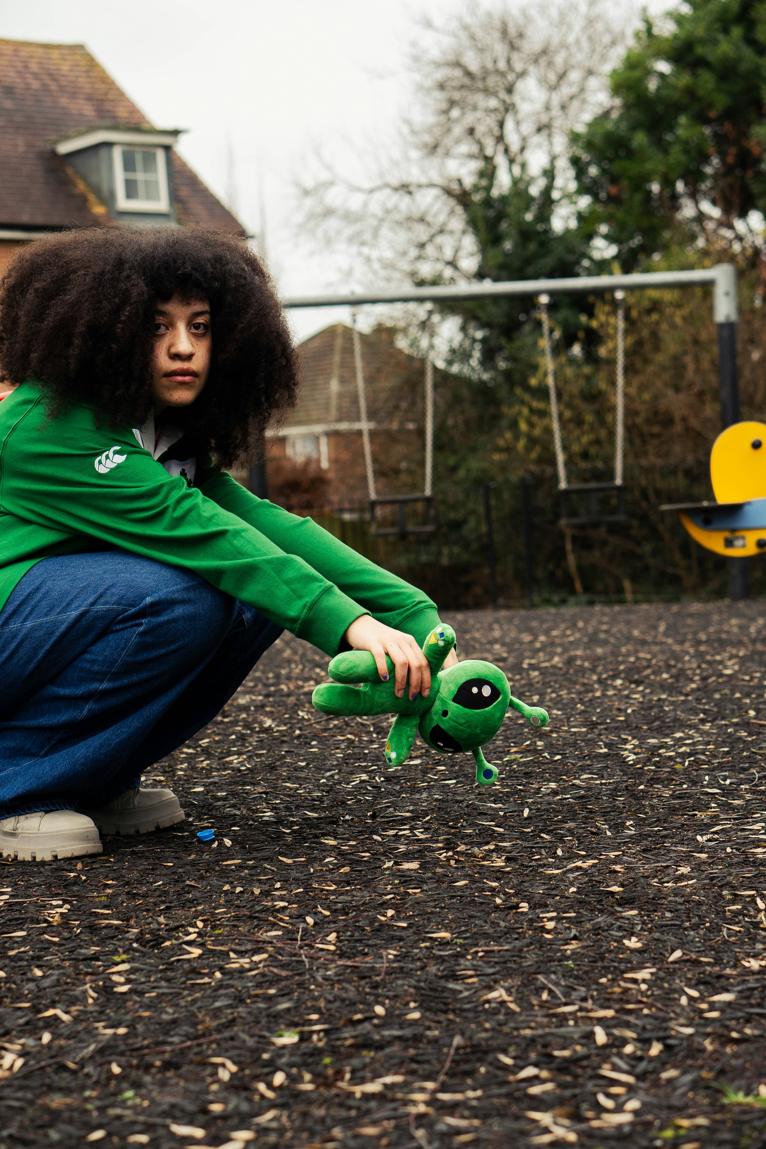 A woman kneeling down holding a stuffed animal photo – Free Photography ...
