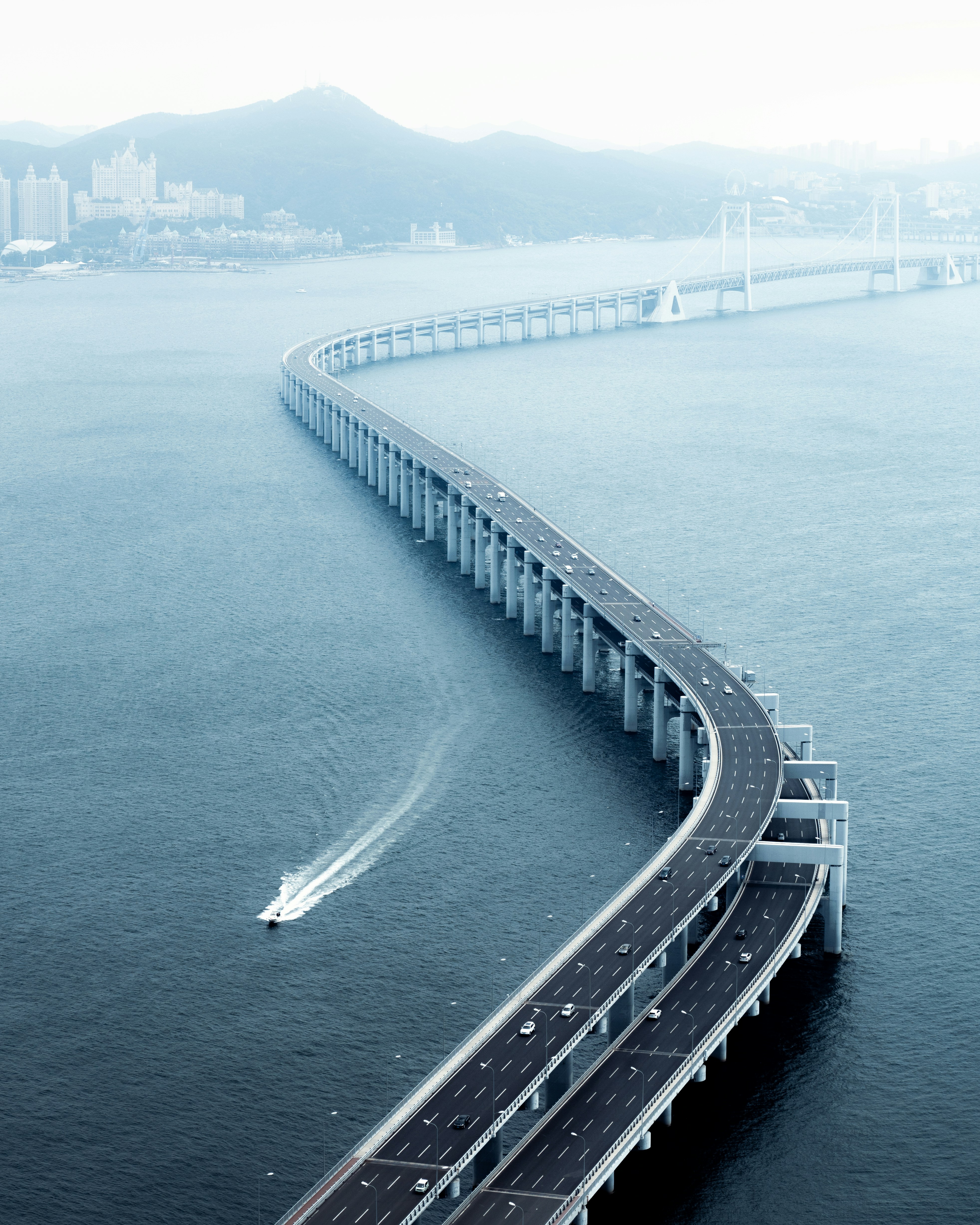 A large bridge over a large body of water photo – Free Blue Image on ...