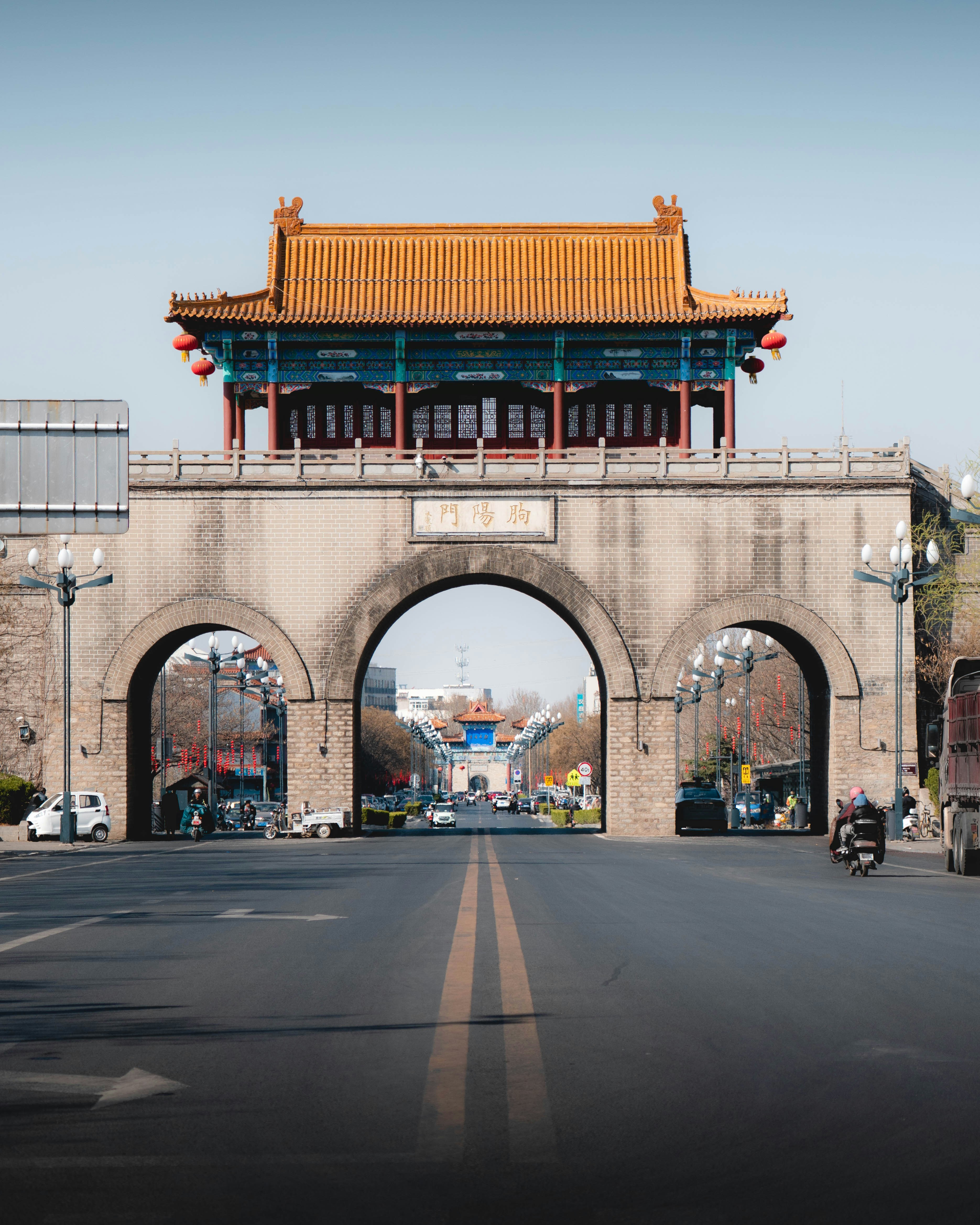 Symmetry at the Gate: A Street Cut Through a Chinese Archway