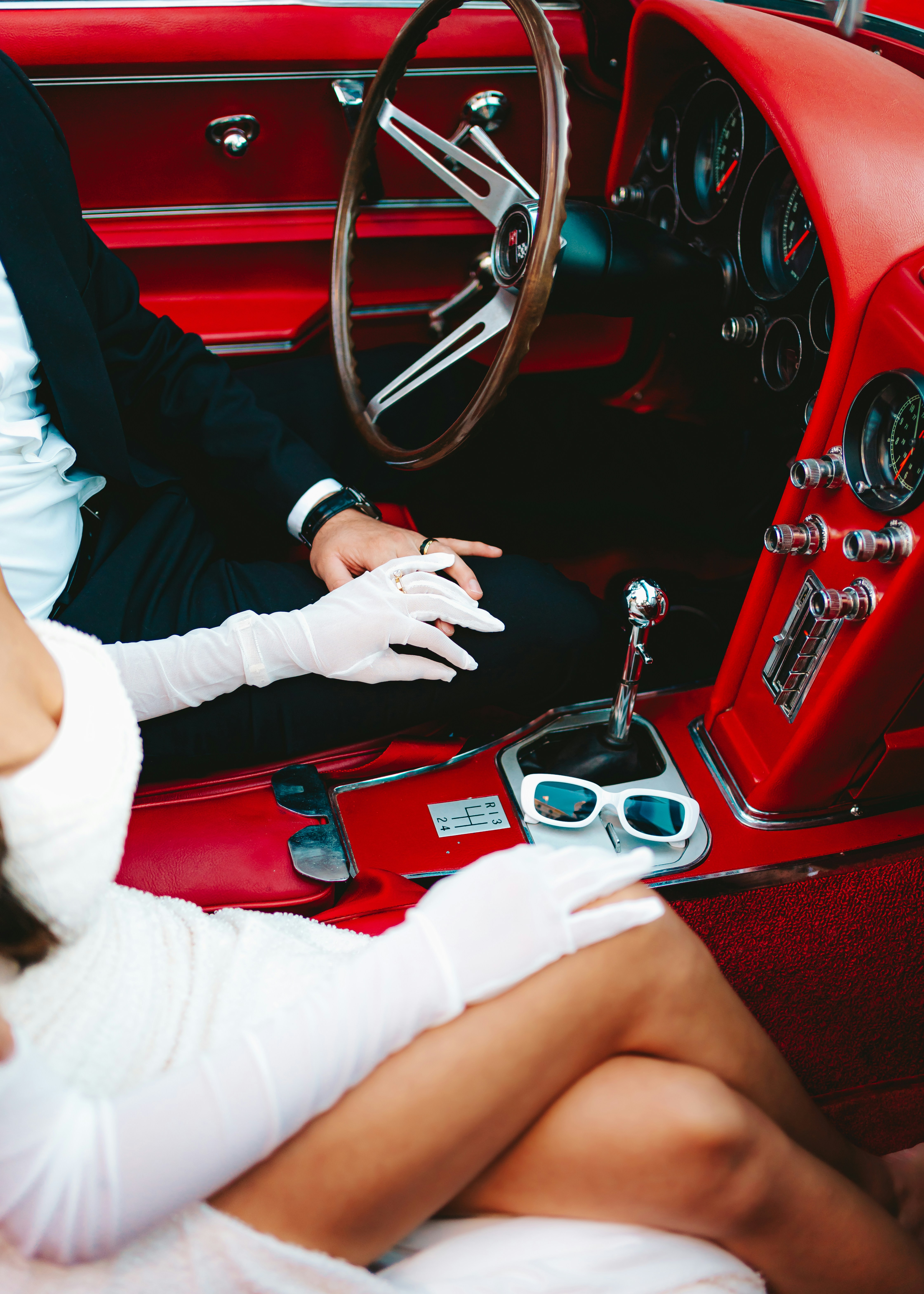 Crimson Vintage: White-Gloved Moment at the Gear Shifter