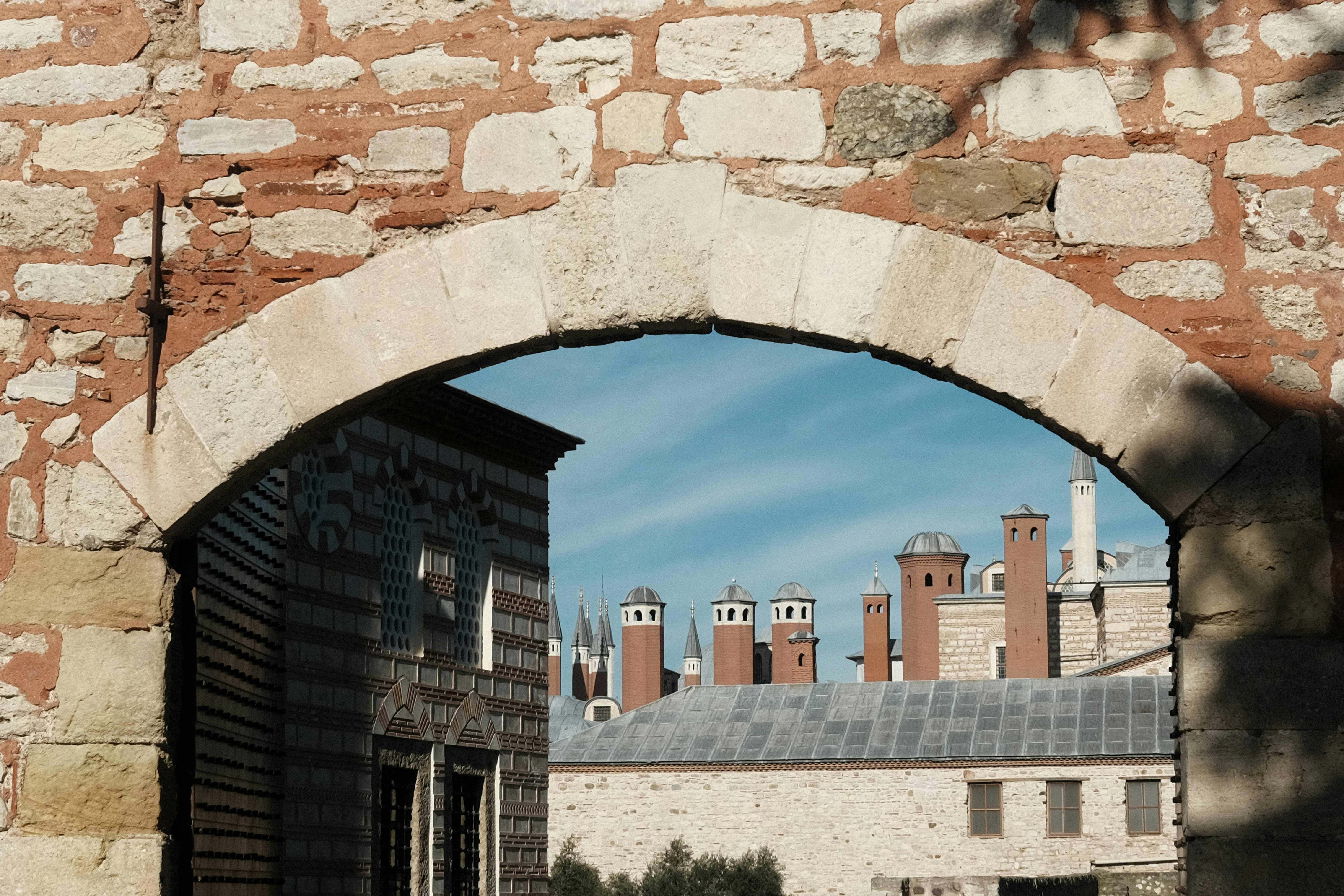 A view of a building through a stone arch photo – Free İstanbul Image ...
