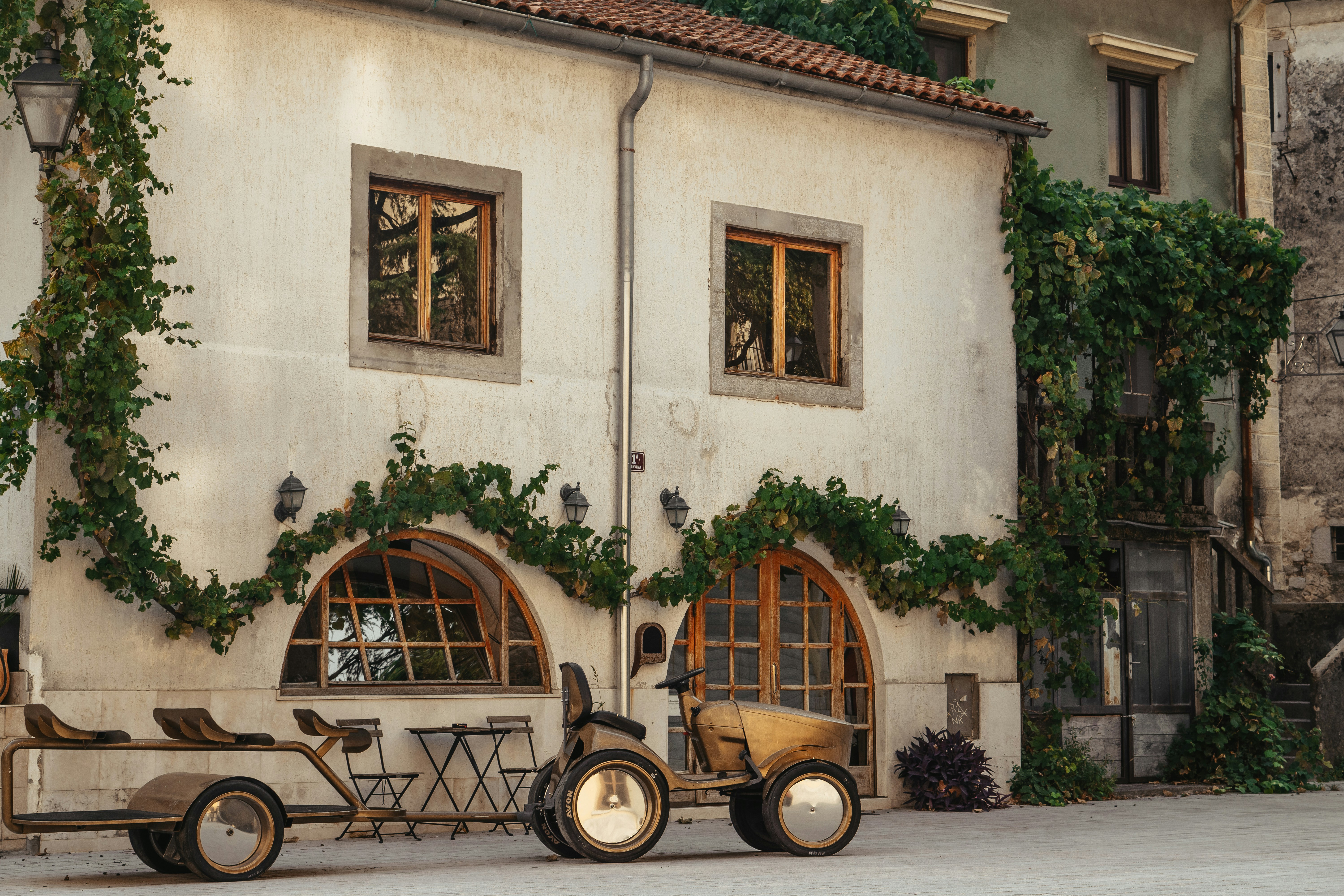 Ivied Cottage Courtyard: A Brass-Wheeled Vintage in Quiet Light
