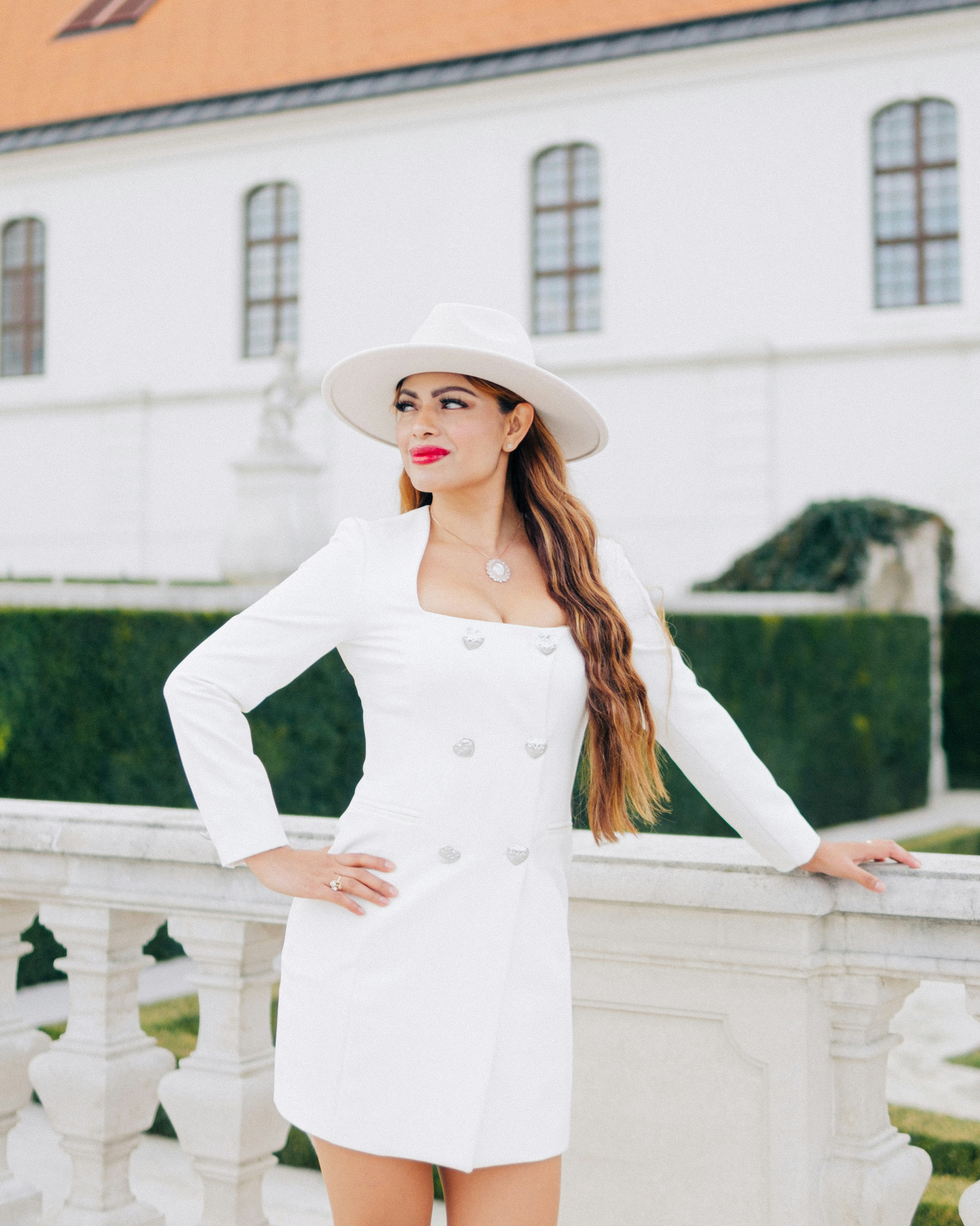 White Attire in the Sunlit Courtyard