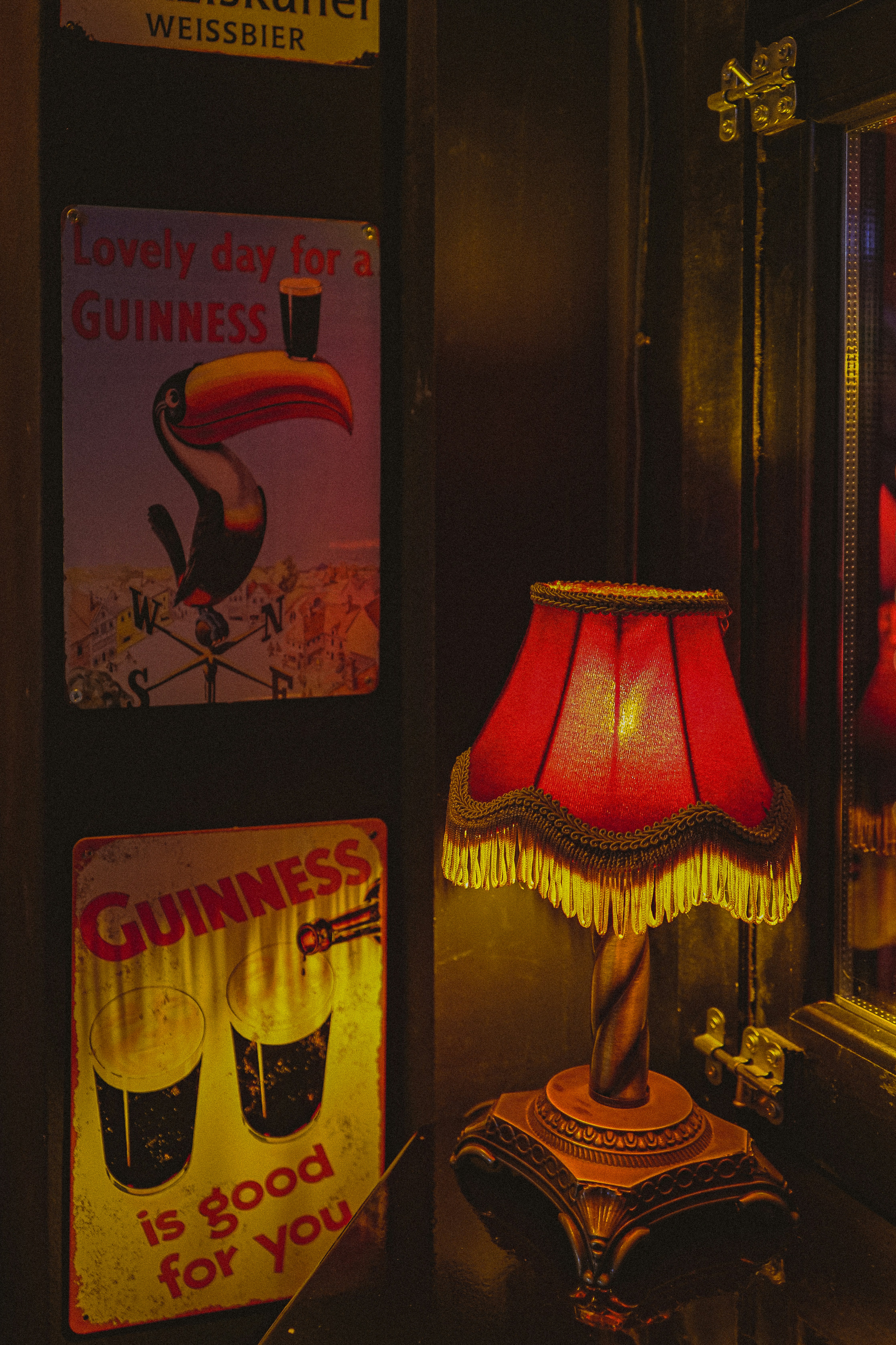 Amber Glow Beneath a Red Lampshade