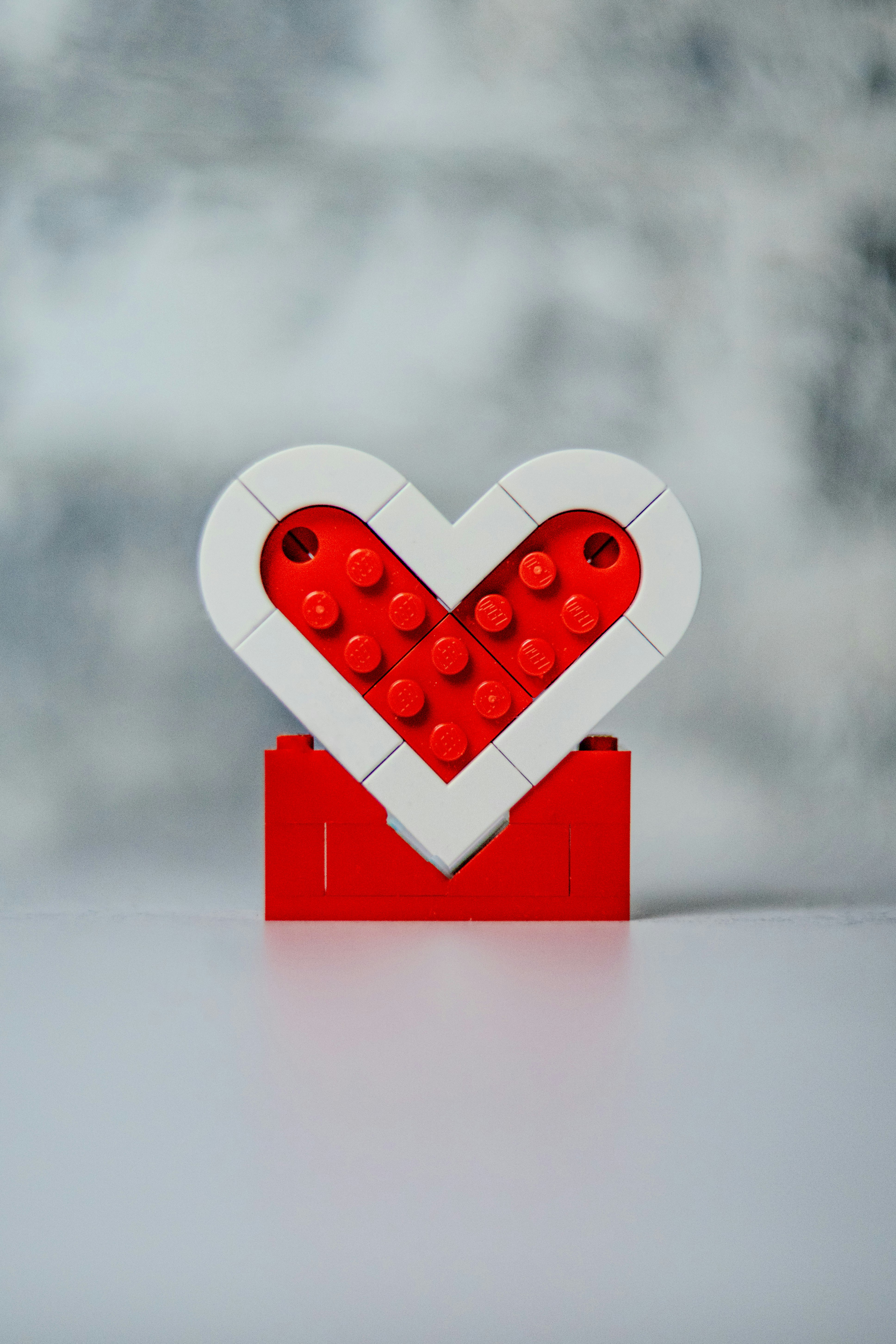 A heart made out of legos sitting on top of a table photo – Free White ...