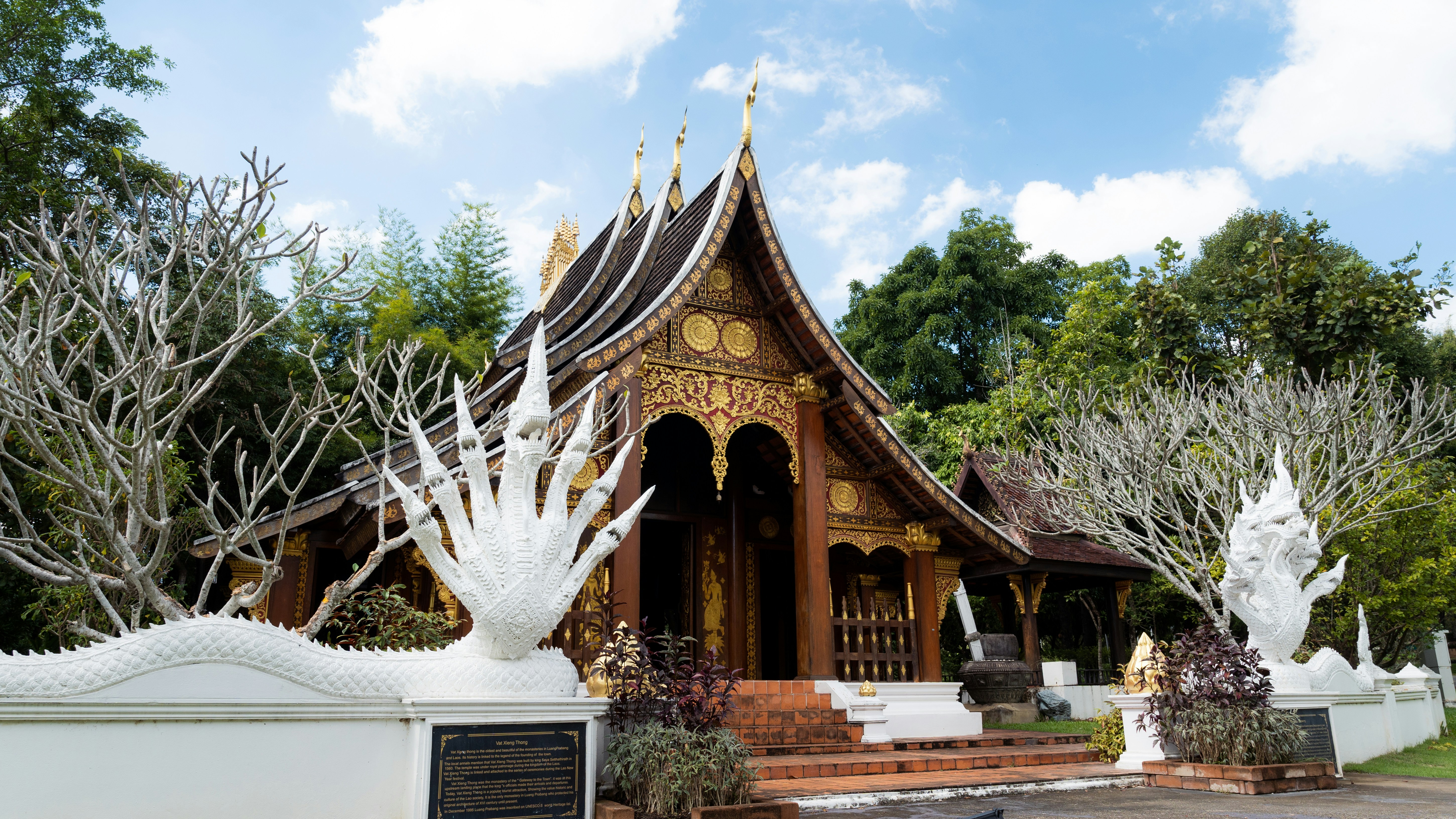 Hands at the Gate: A Timber Temple Framed by Silent Guardians
