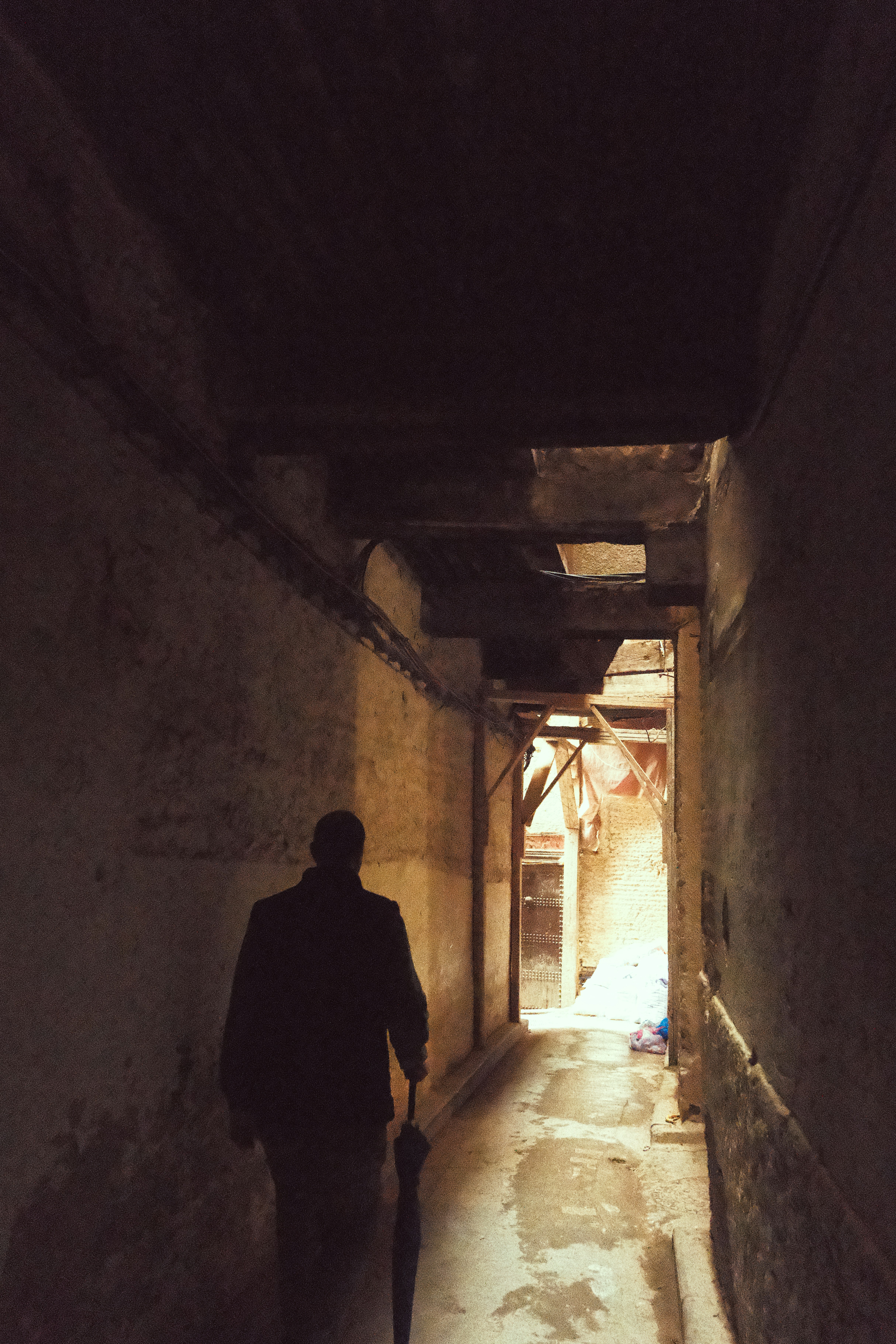 Threshold into Light: A Silent Walk Through a Narrow Corridor
